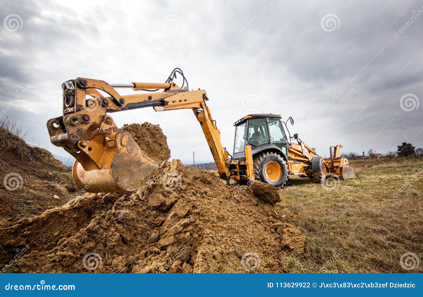 Excavator Doing Earthworks on Site Stock Photo - Image of excavator ...