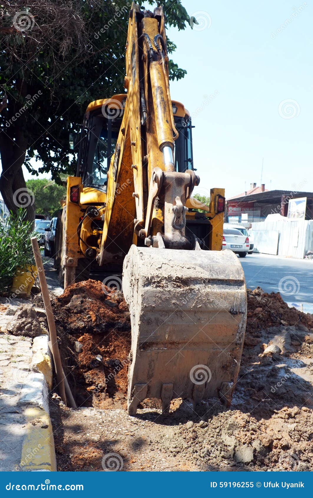 Excavator doing roadwork stock image. Image of civil - 59196255