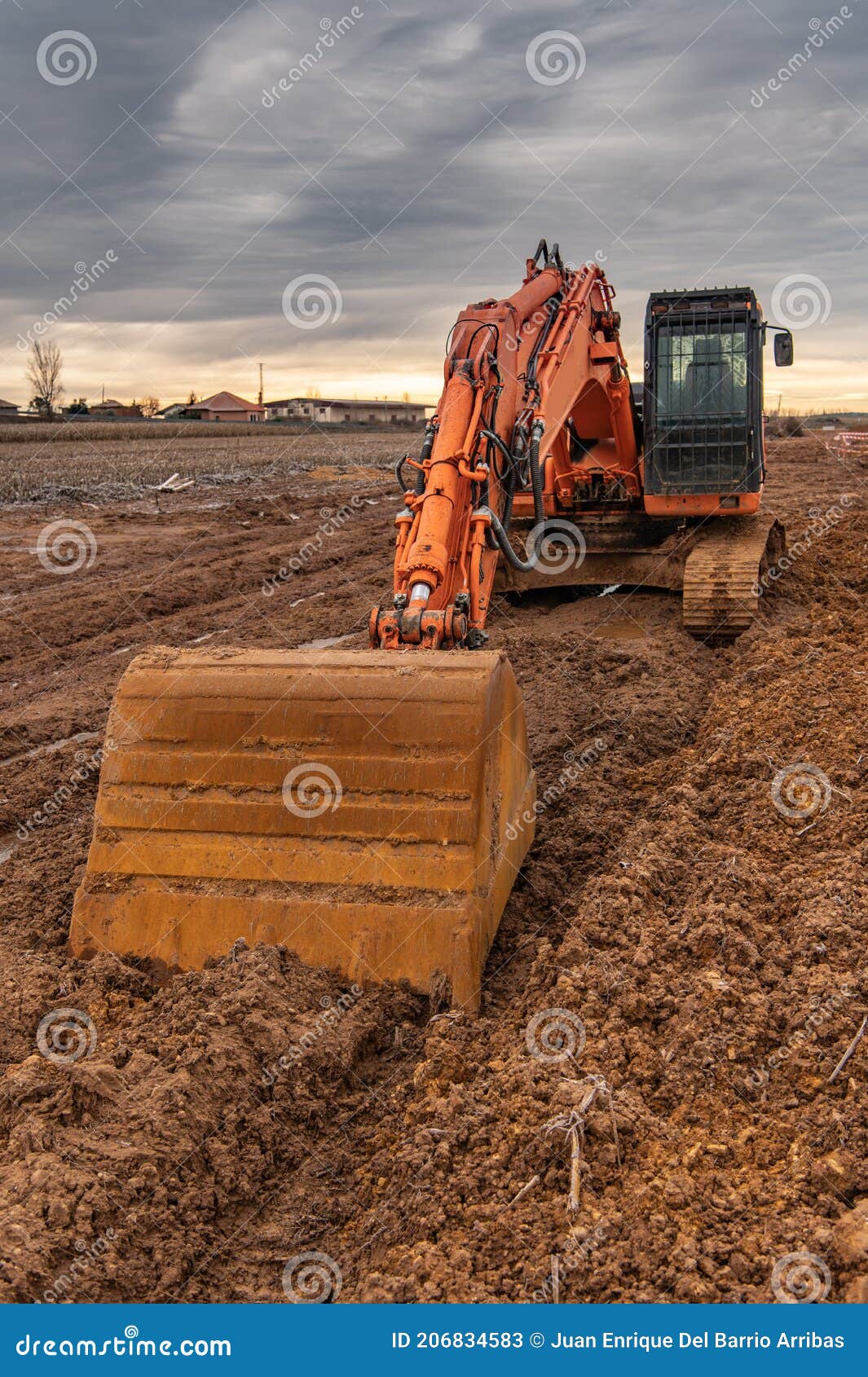 Excavator Doing Work on a Wet and Muddy Winter Day Stock Image - Image ...