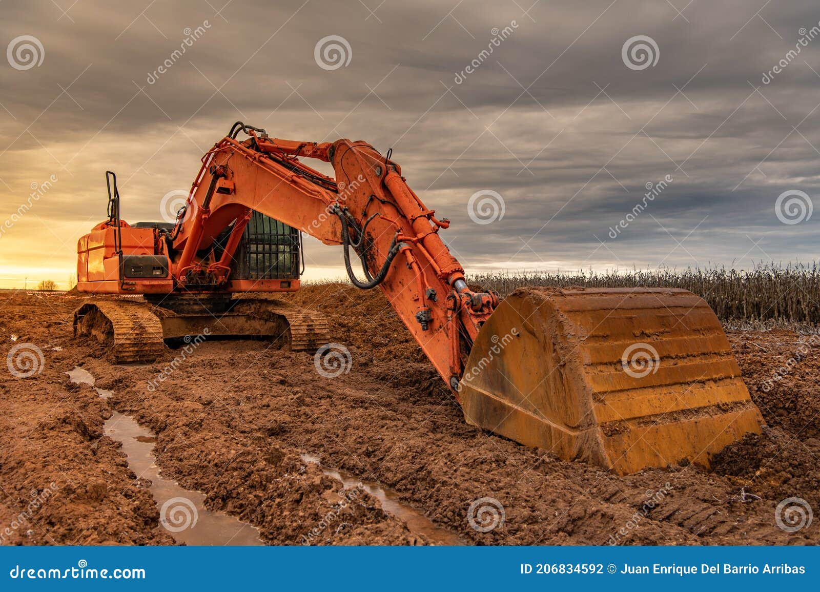 Excavator Doing Work on a Wet and Muddy Winter Day Stock Photo - Image ...