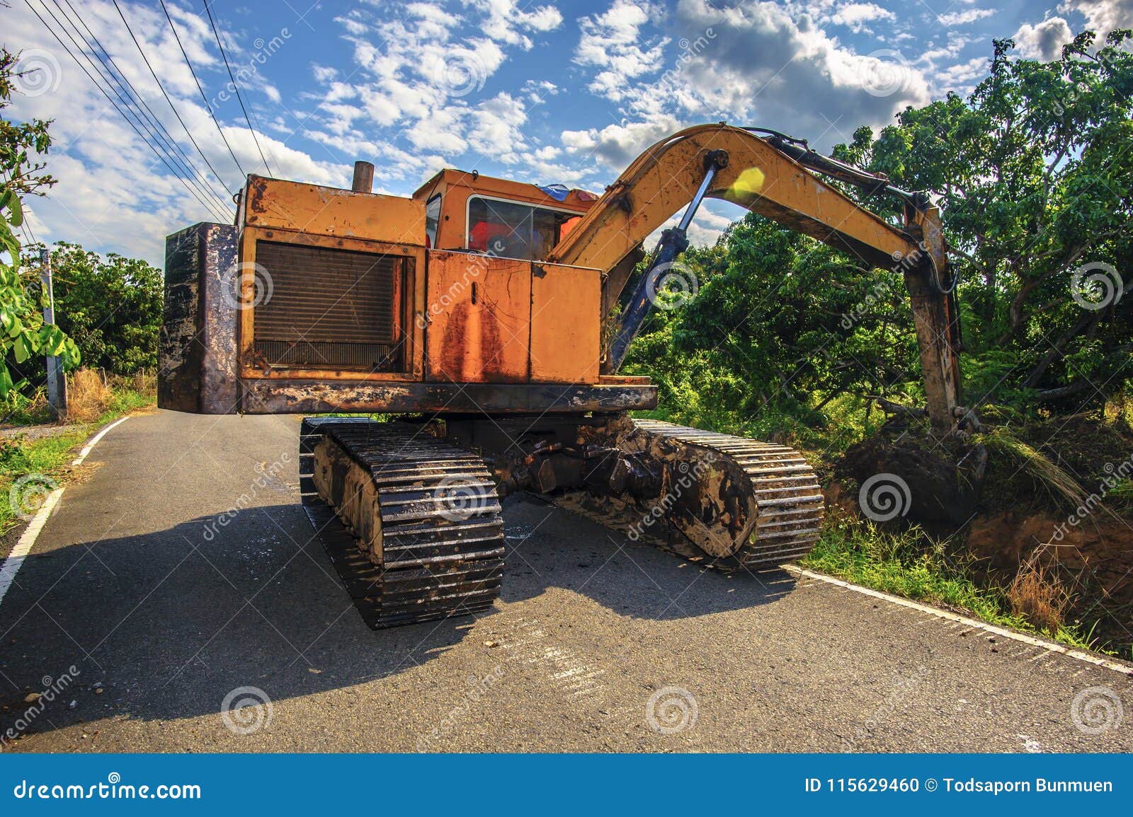 Excavator Dredging Mud At Mangrove. Backhoe Digging Mud At Construction ...