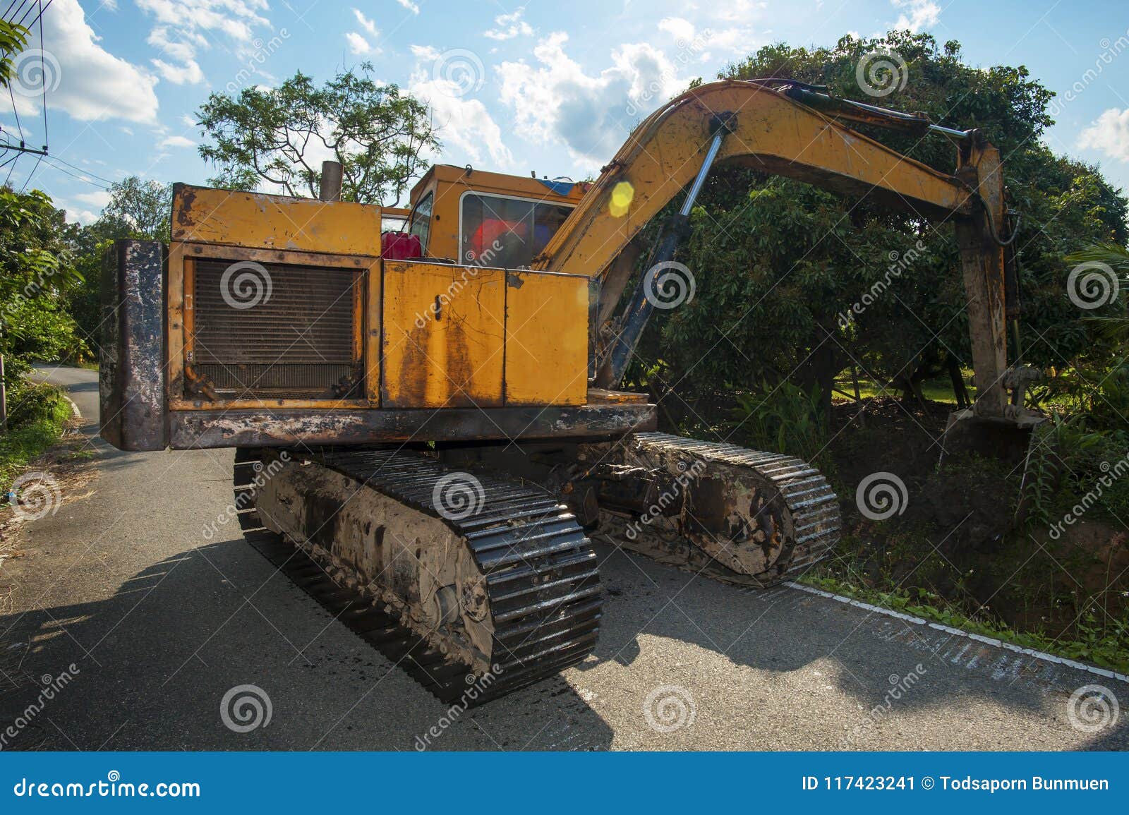Excavator Dredging Mud At Mangrove. Backhoe Digging Mud At Construction ...