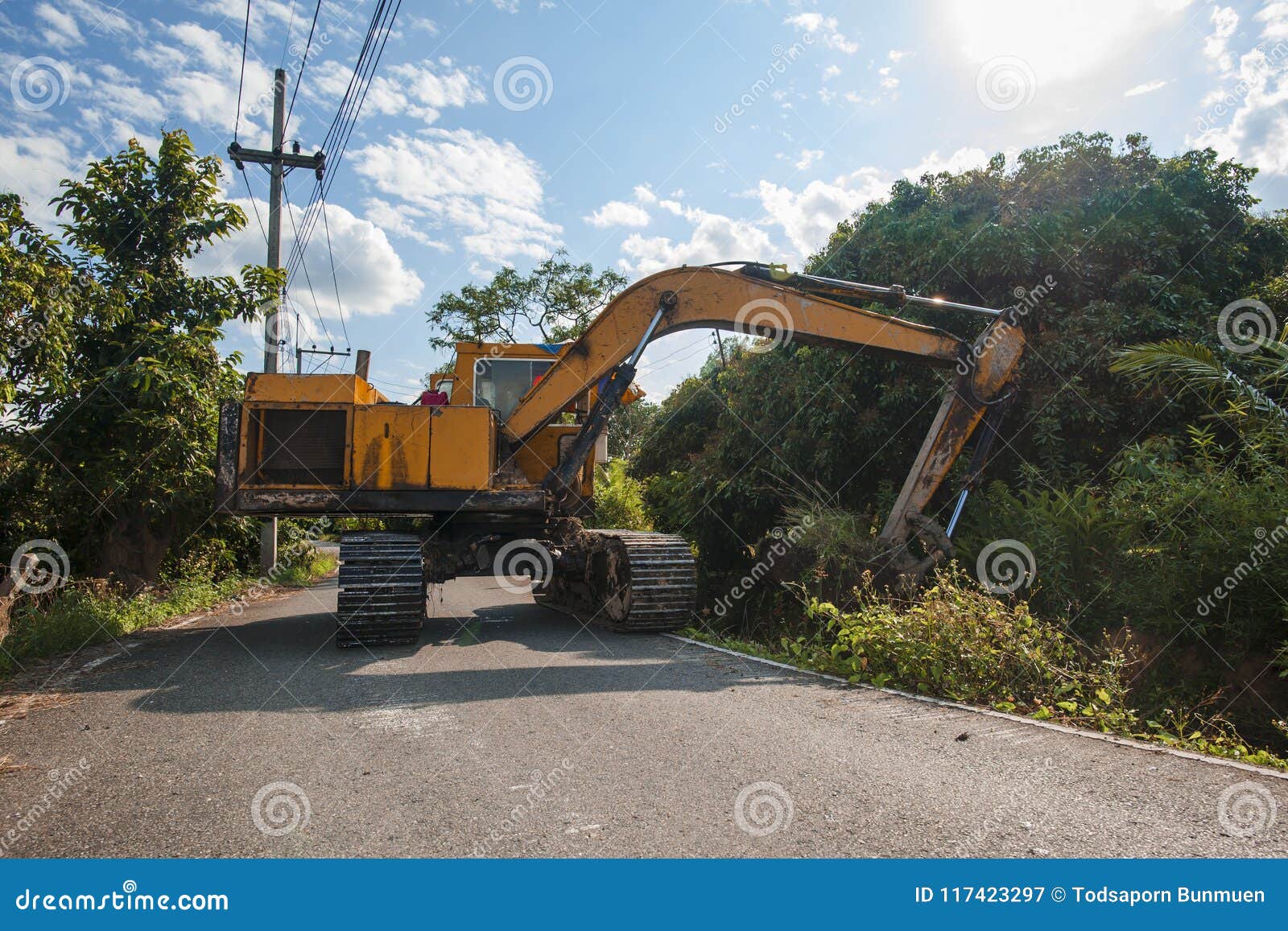 Excavator Dredging Mud At Mangrove. Backhoe Digging Mud At Construction ...