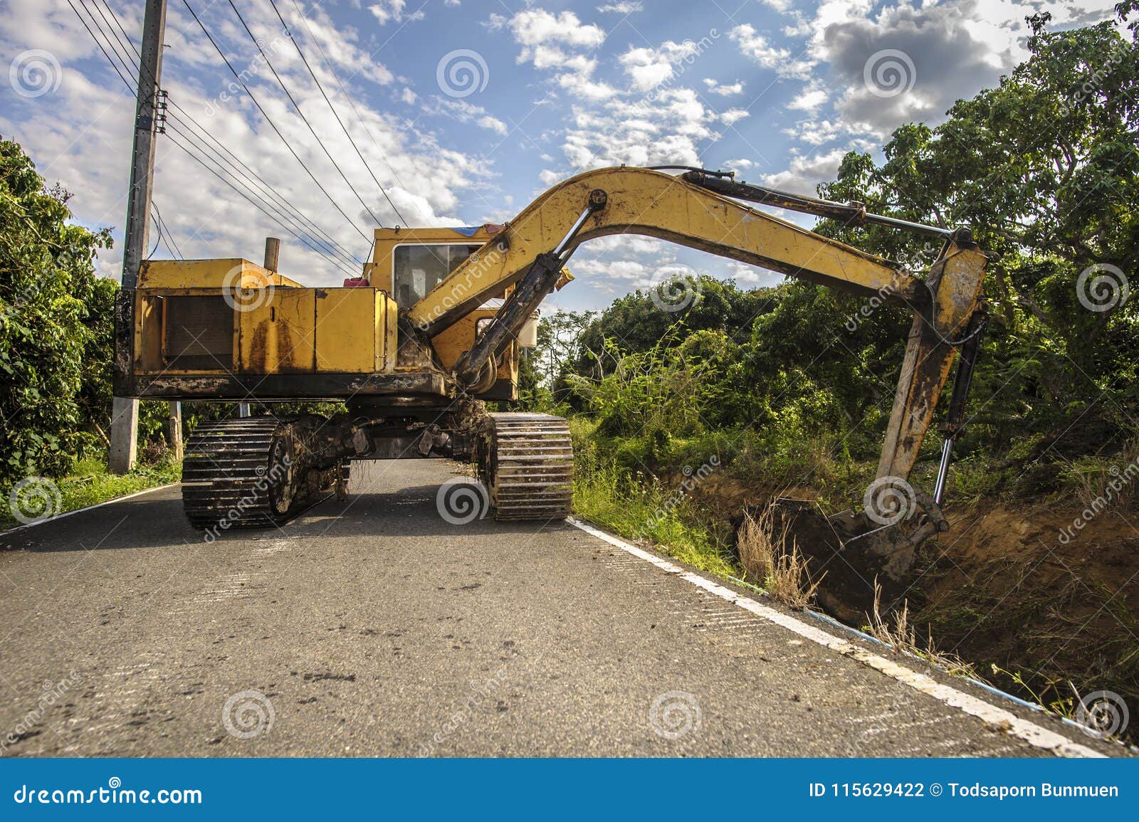 Excavator Dredging Mud At Mangrove. Backhoe Digging Mud At Construction ...