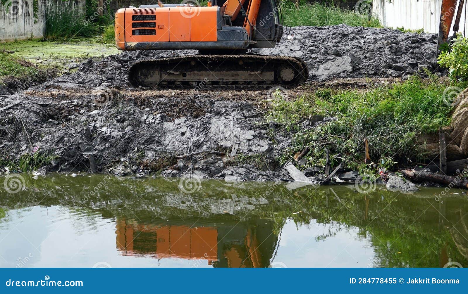 Excavator Dredging Mud At Mangrove. Backhoe Digging Mud At Construction ...