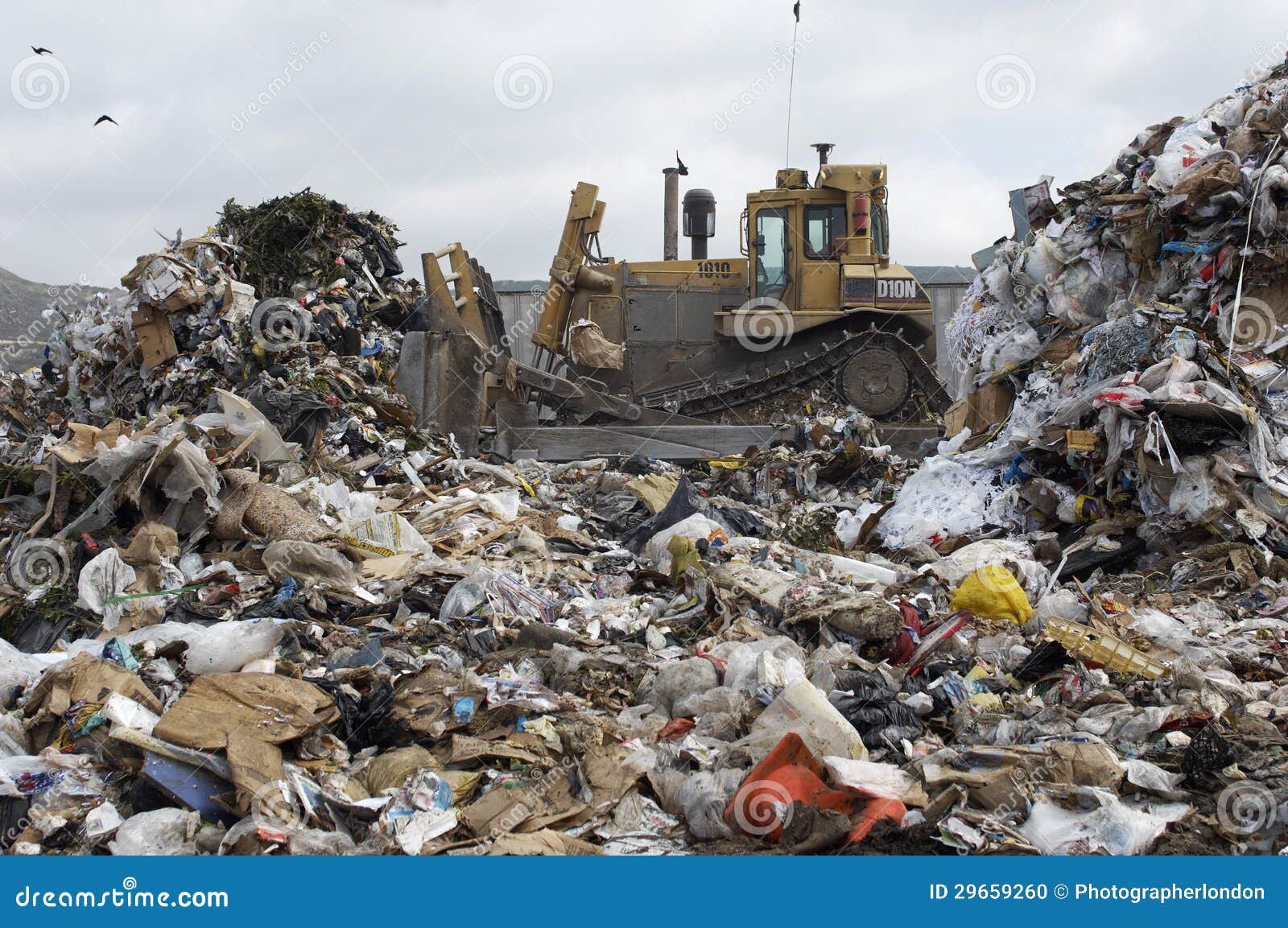 Excavator at Dumping Ground Stock Photo - Image of issues, equipment ...