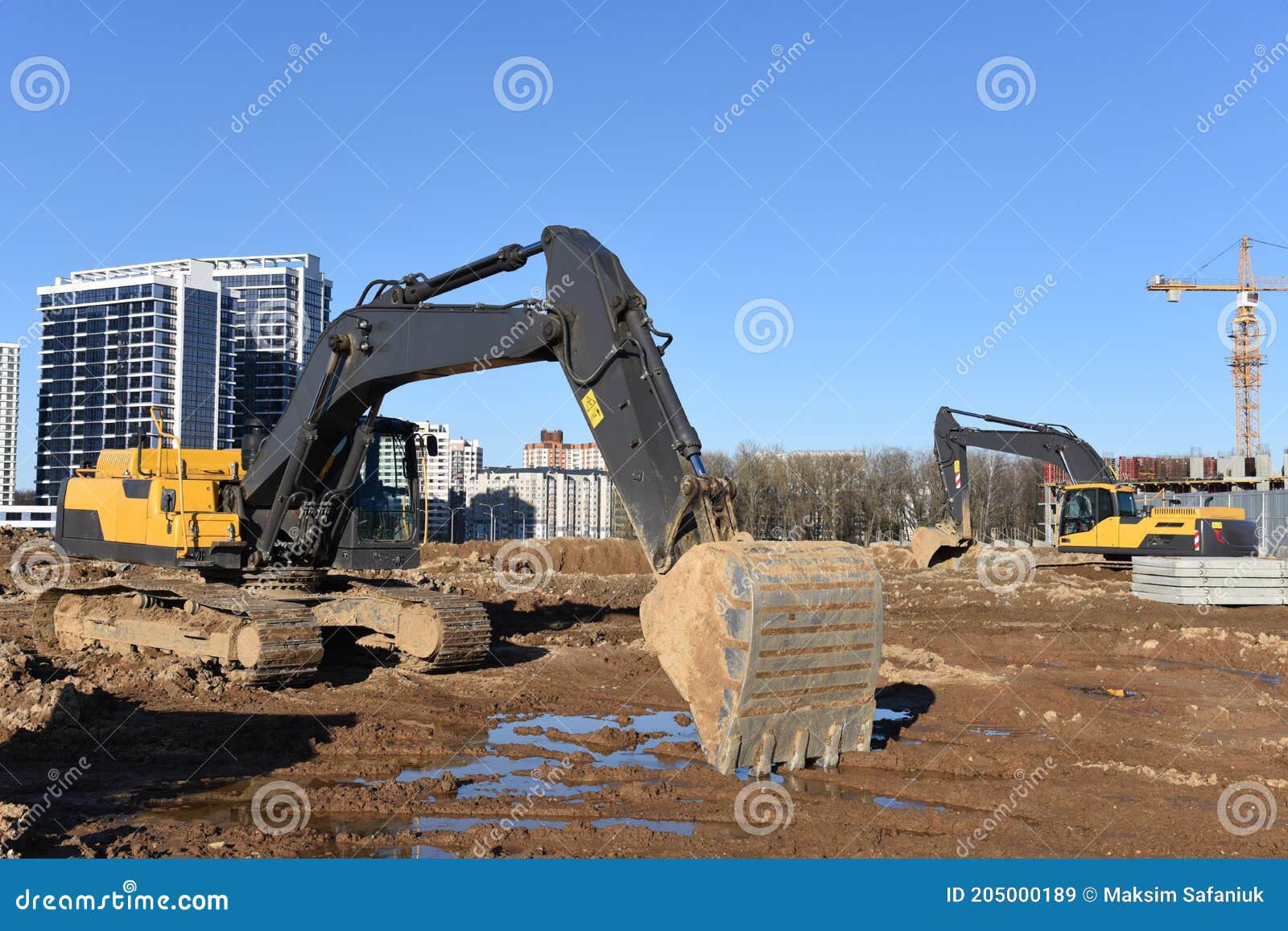 Excavator during Earthmoving at Construction Site. Backhoe Dig Ground ...