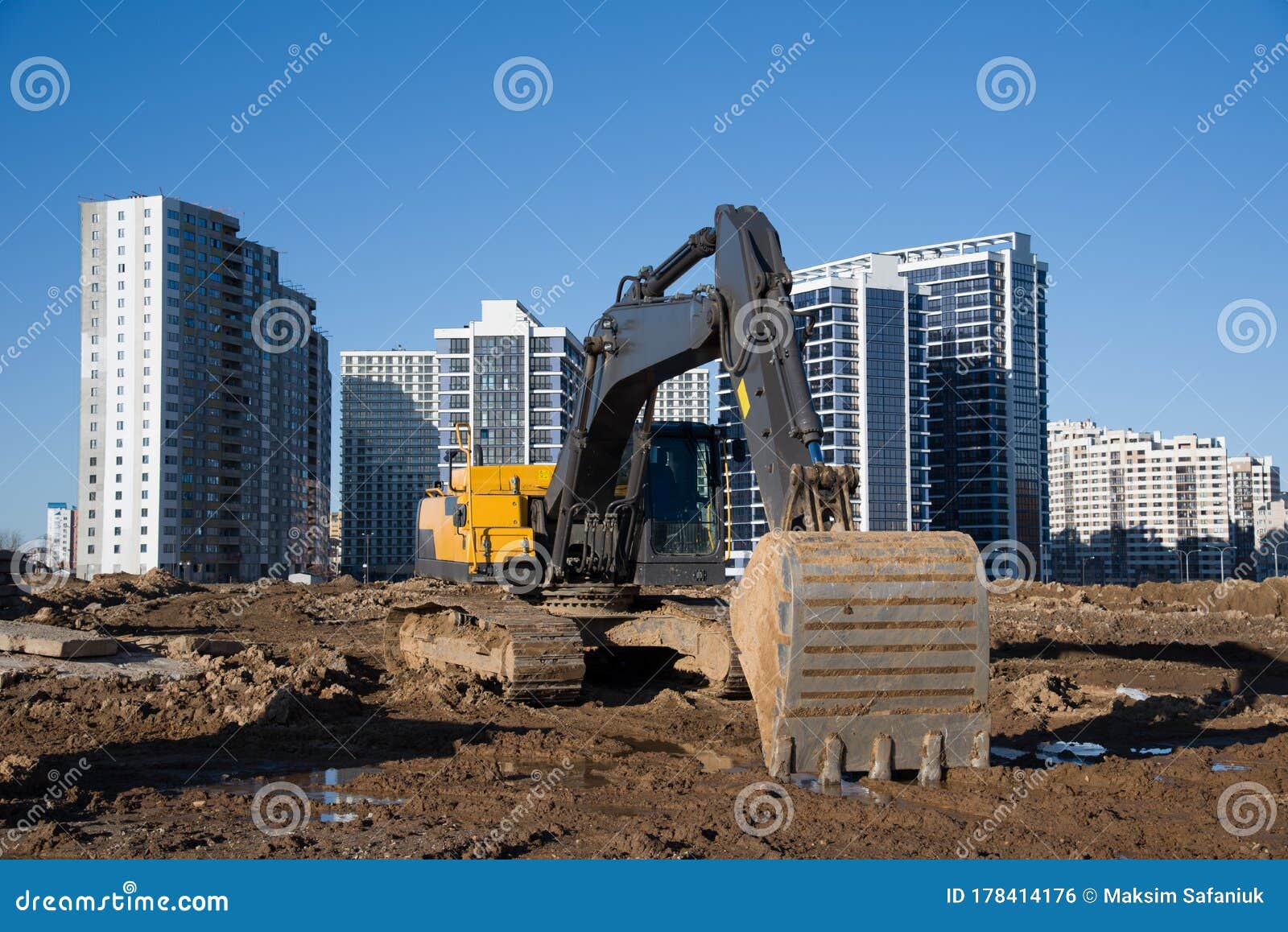 Excavator during Earthmoving at Construction Site on Blue Sky ...