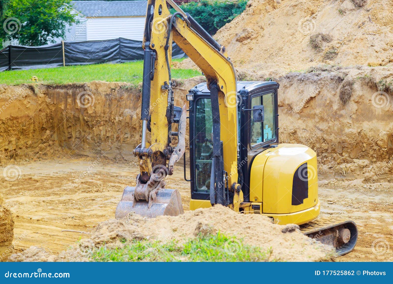 Excavator During Earthmoving At Construction Site On Sunset Background ...