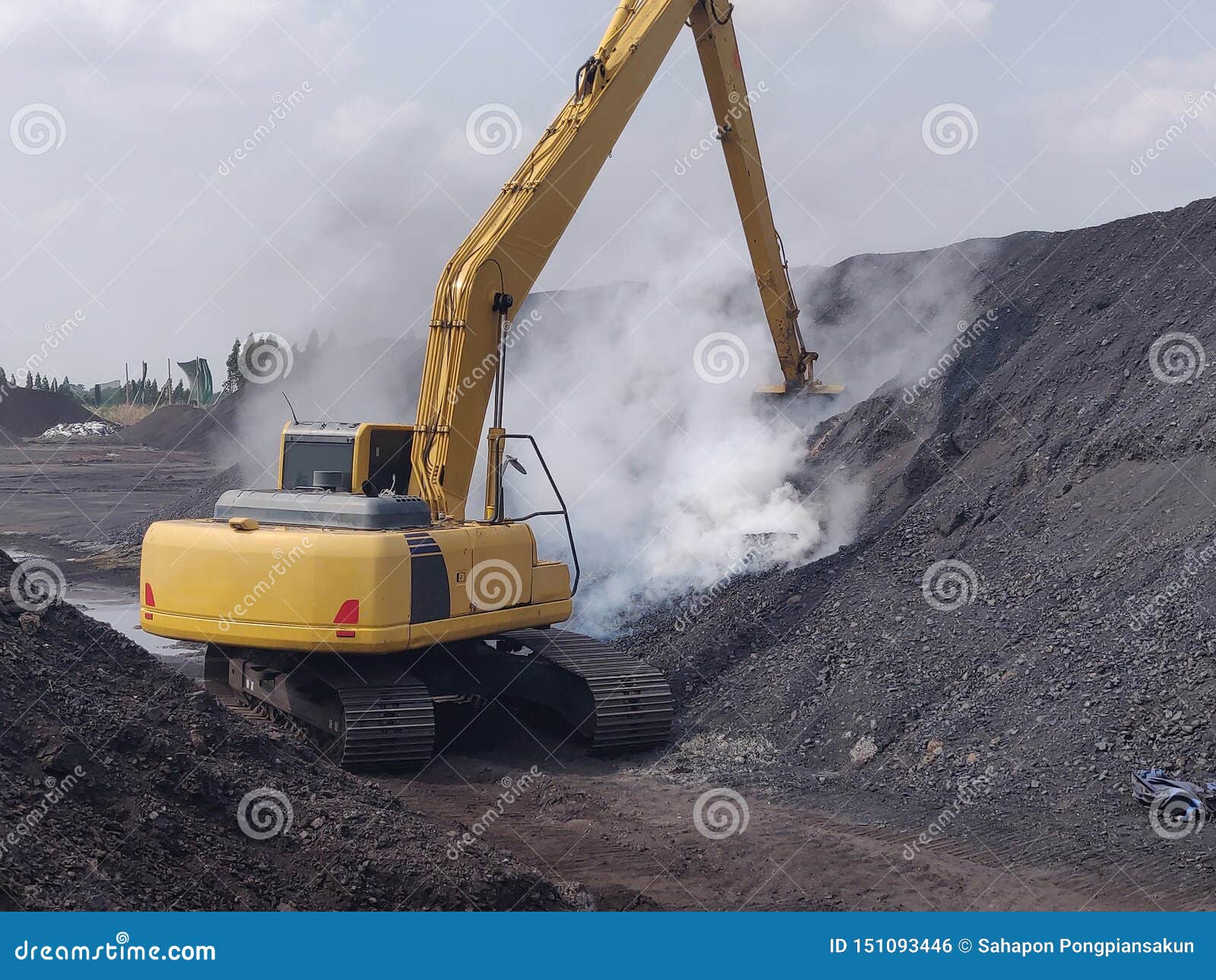The Excavator Extinguish Fires From Coal Spontaneous Combustion Stock ...