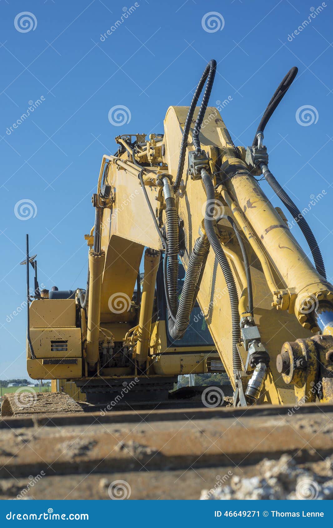 Excavator With Blue Sunny Sky In The Background Stock Photography ...
