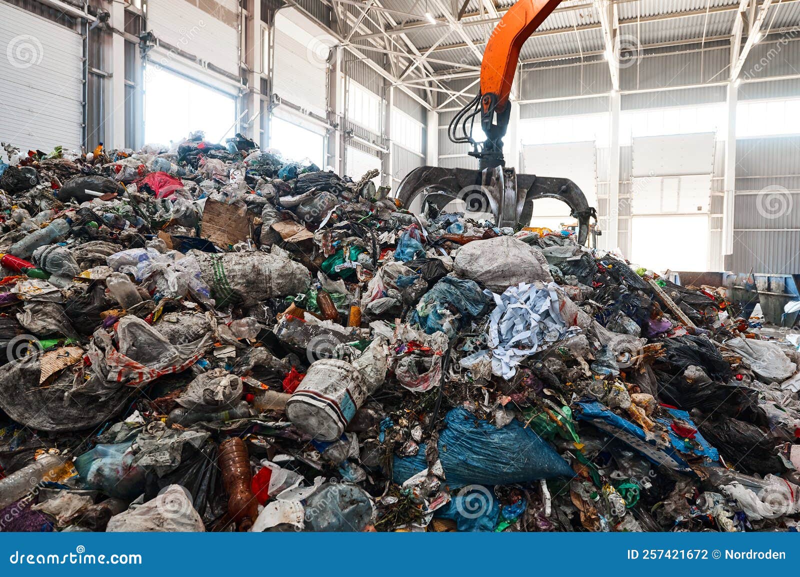Excavator Grabs Trash in Warehouse of Waste Processing Plant Stock ...