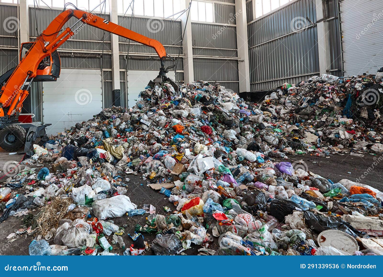 Excavator Grabs Trash in Warehouse of Waste Processing Plant Stock ...