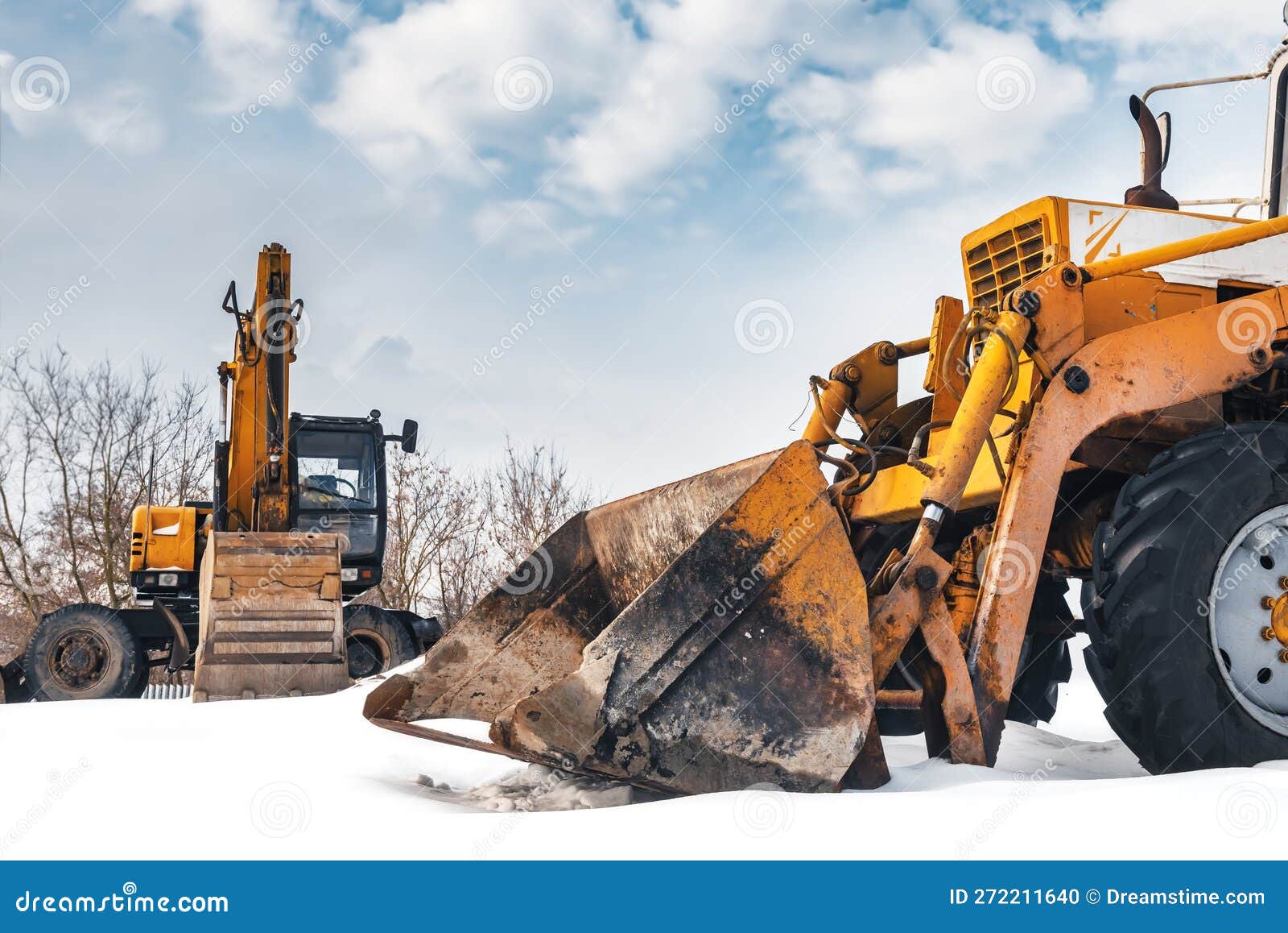 Excavator, Grader in Winter at the Construction Site. Construction ...