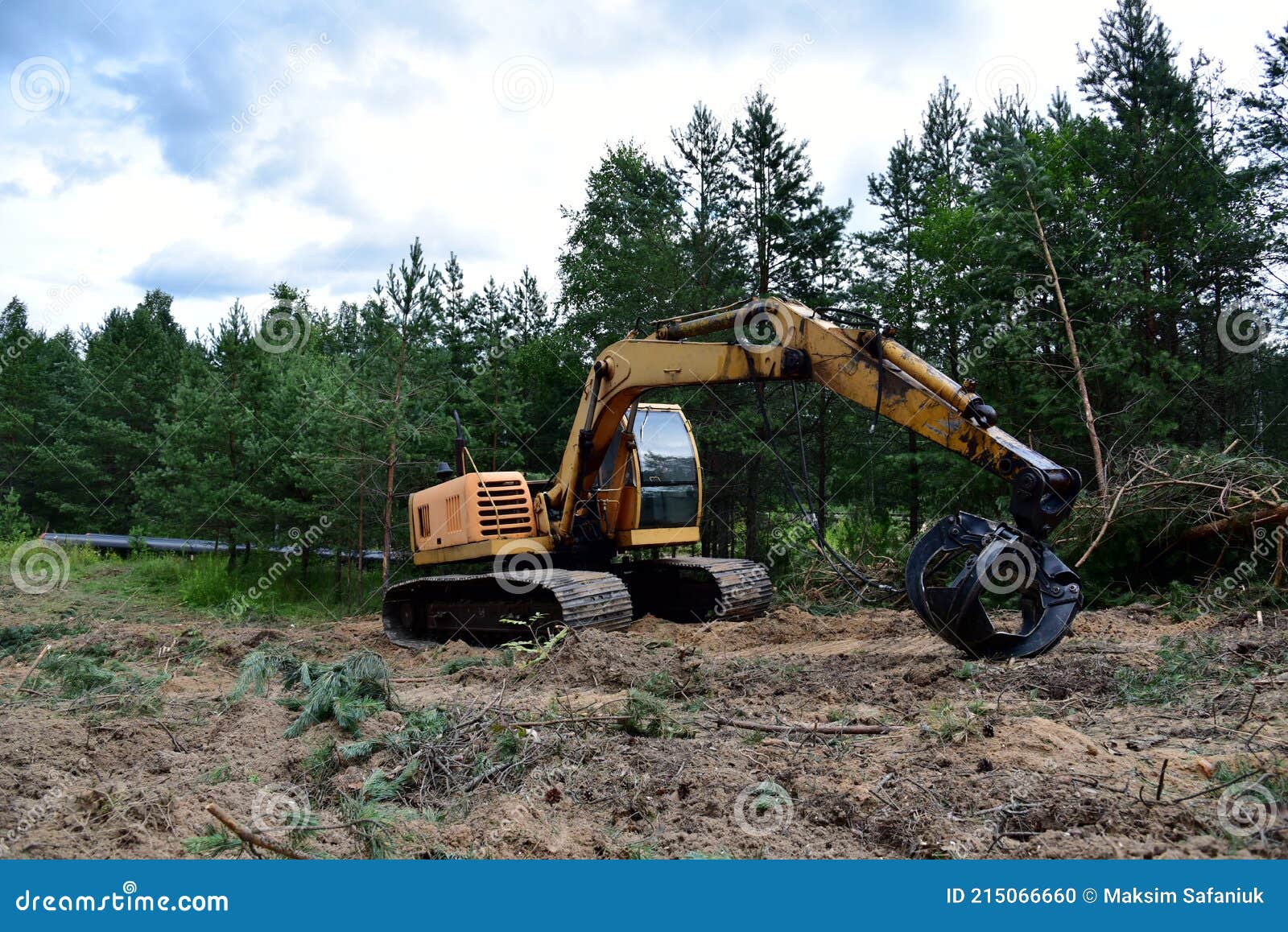 Excavator Grapple during Clearing Forest for New Development. Tracked ...
