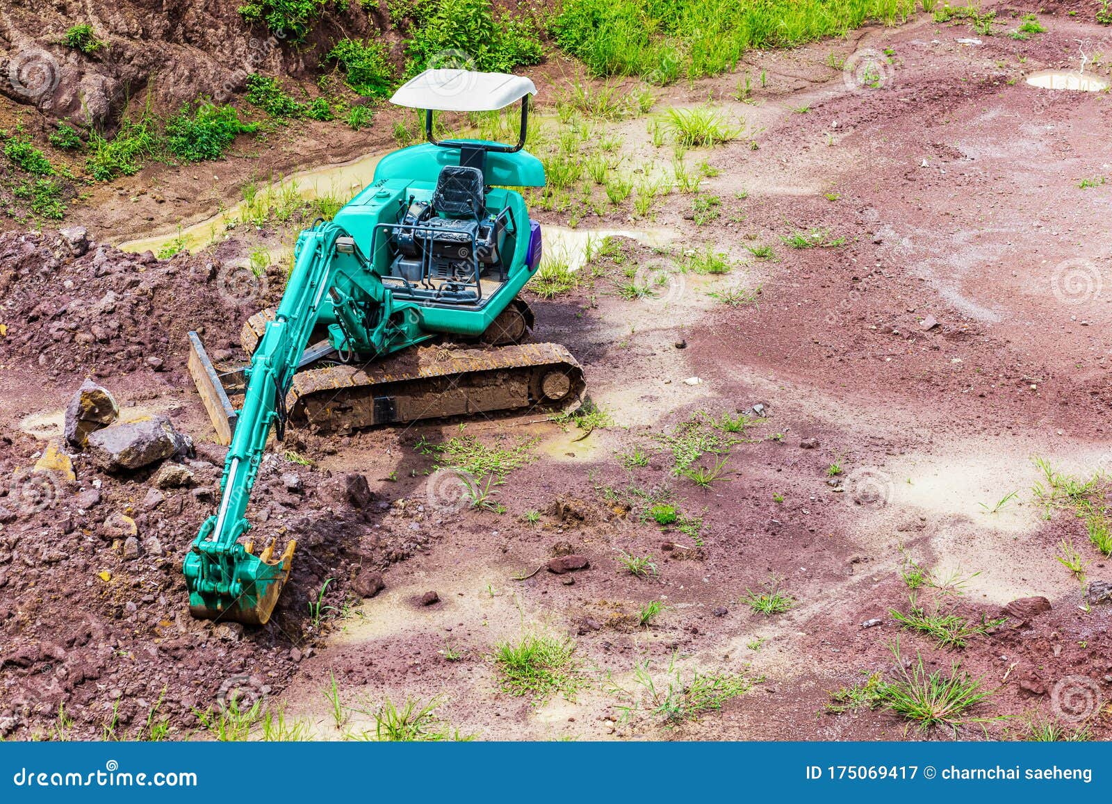 Excavator Dig Ground At A Construction Site. Trench For Laying External ...