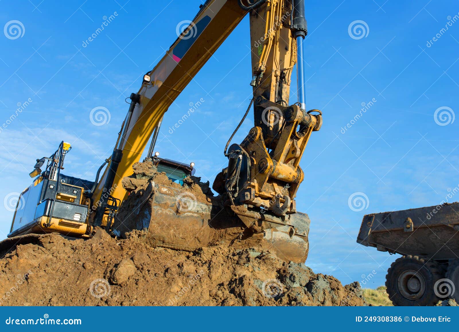 Backhoe in Action on a Construction Site Close Up Stock Photo - Image ...