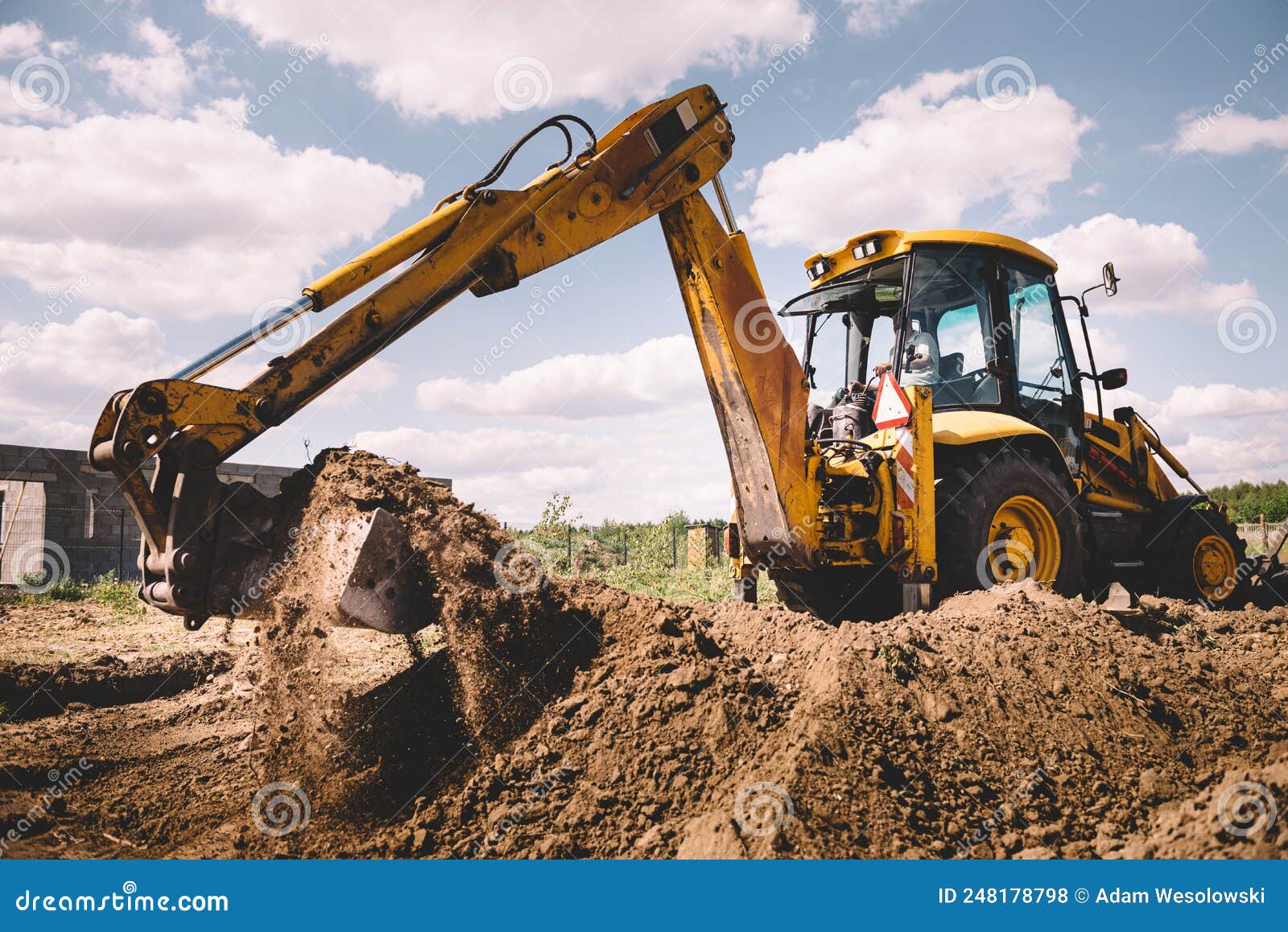 Excavator at House Construction Site - Digging Foundations for Modern ...