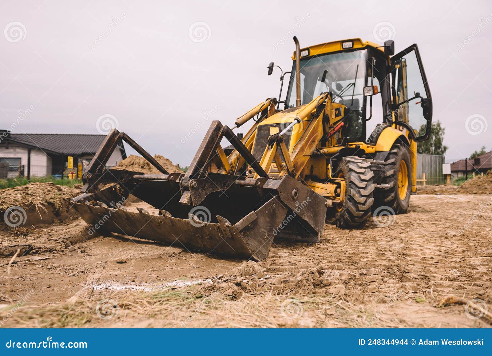 Excavator at House Construction Site - Digging Foundations for Modern ...