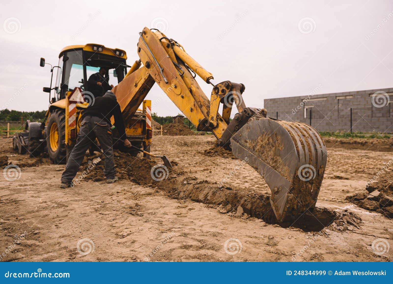 Excavator at House Construction Site - Digging Foundations for Modern ...