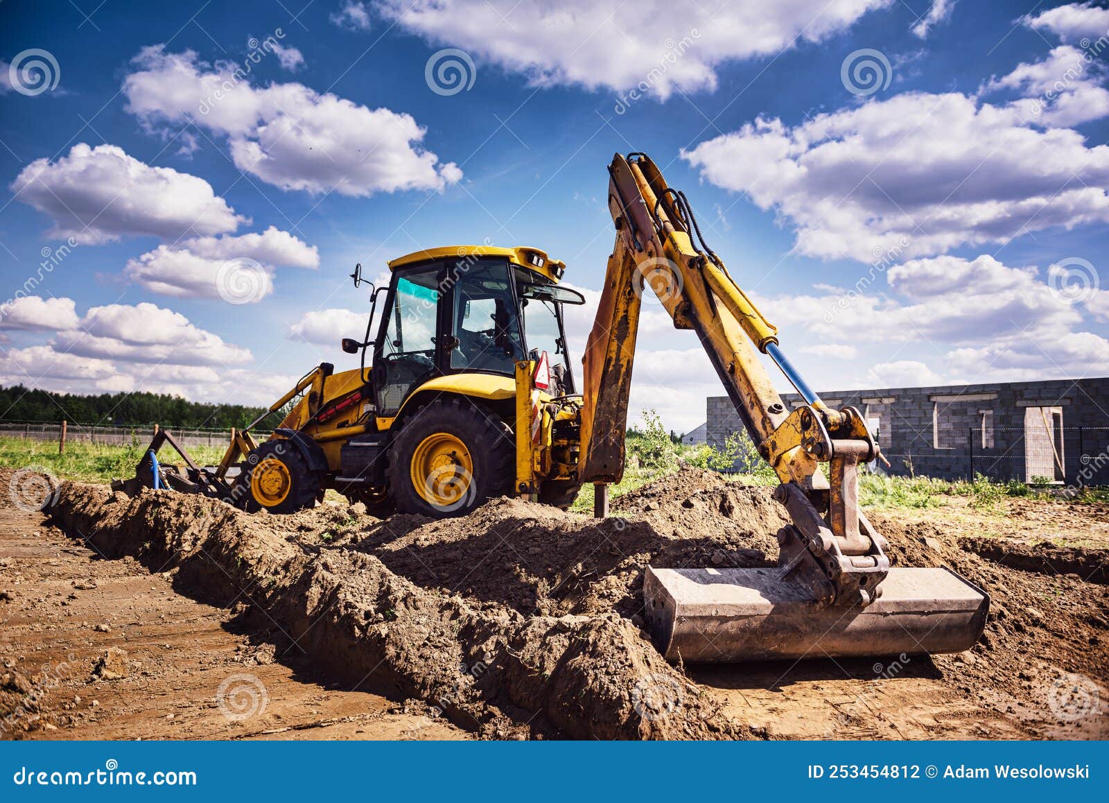 Excavator at House Construction Site - Digging Foundations for Modern ...