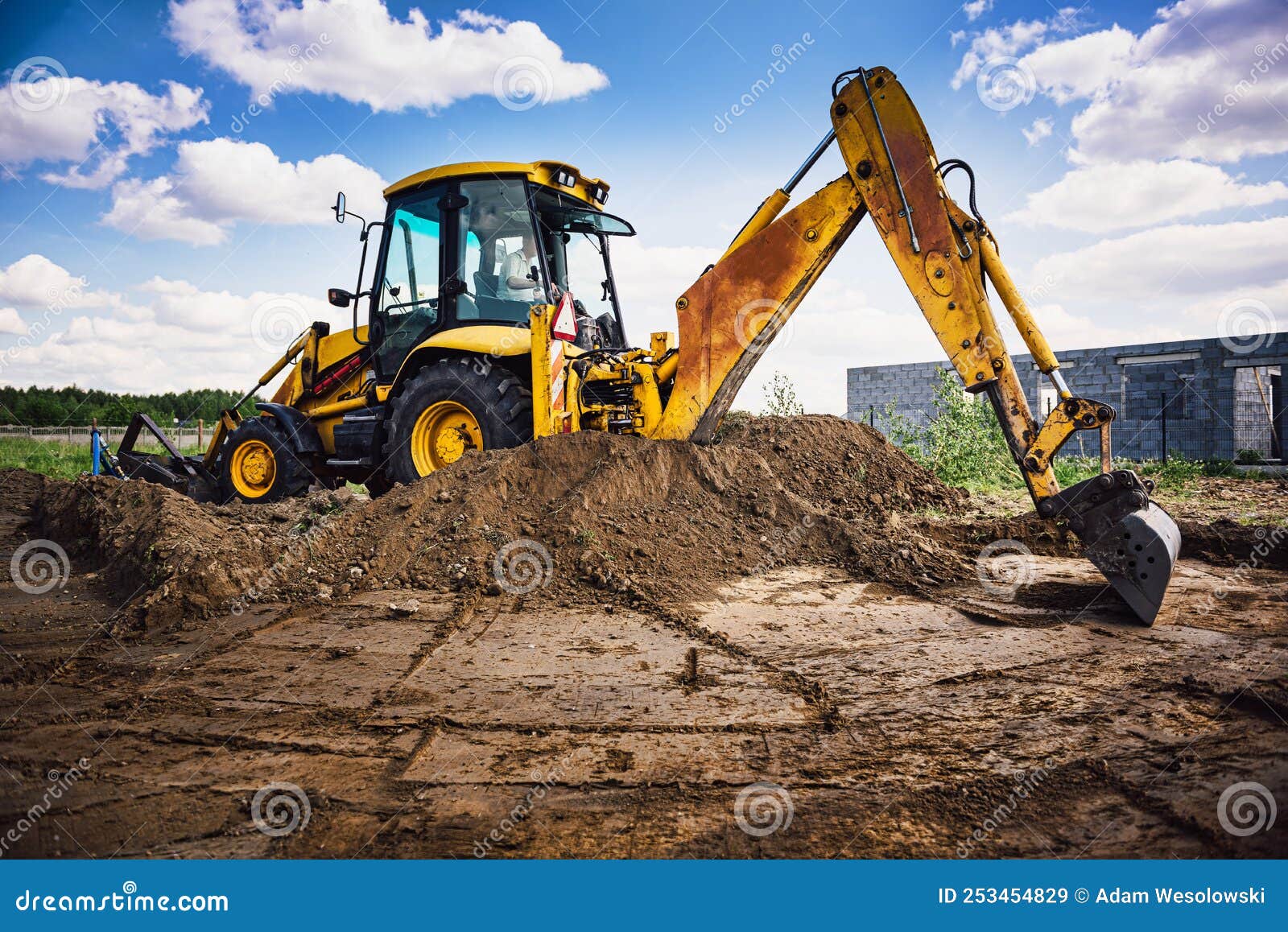 Excavator at House Construction Site - Digging Foundations for Modern ...