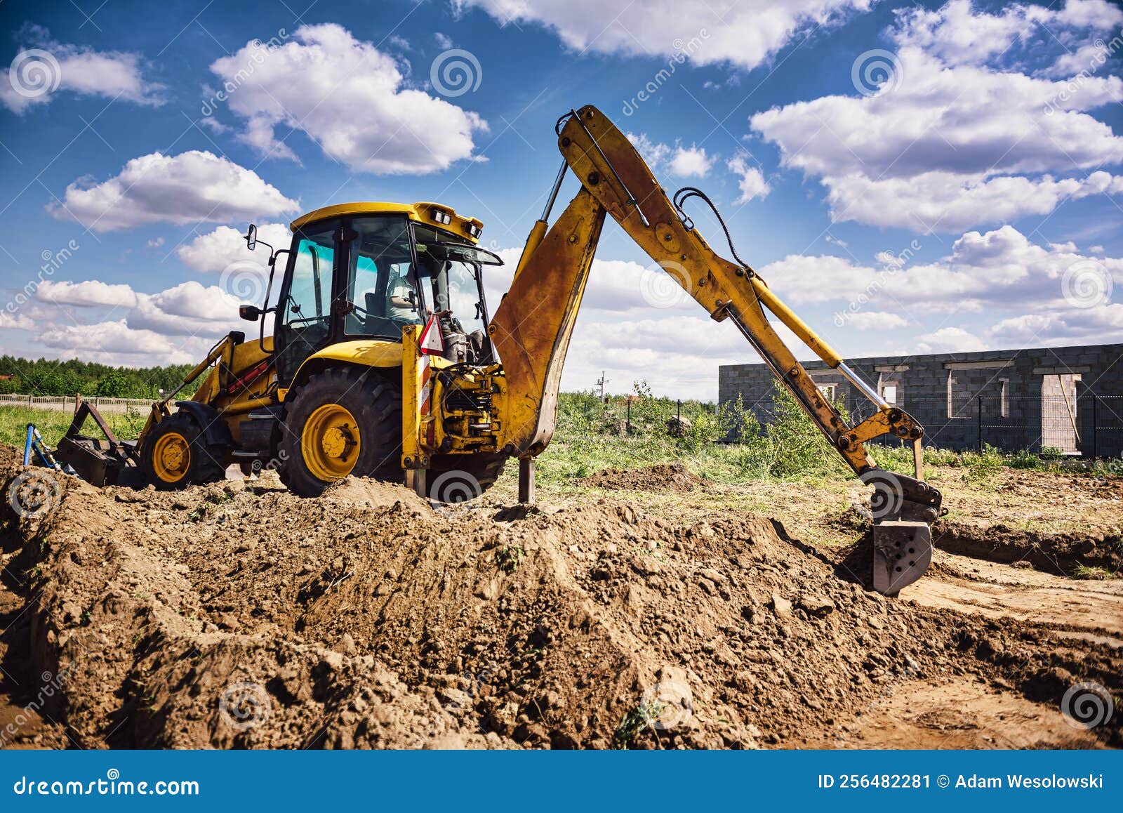 Excavator at House Construction Site - Digging Foundations for Modern ...