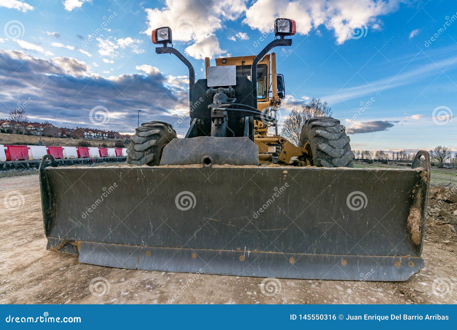 Excavator Leveling Pavement in the Construction of a Road Stock Photo ...