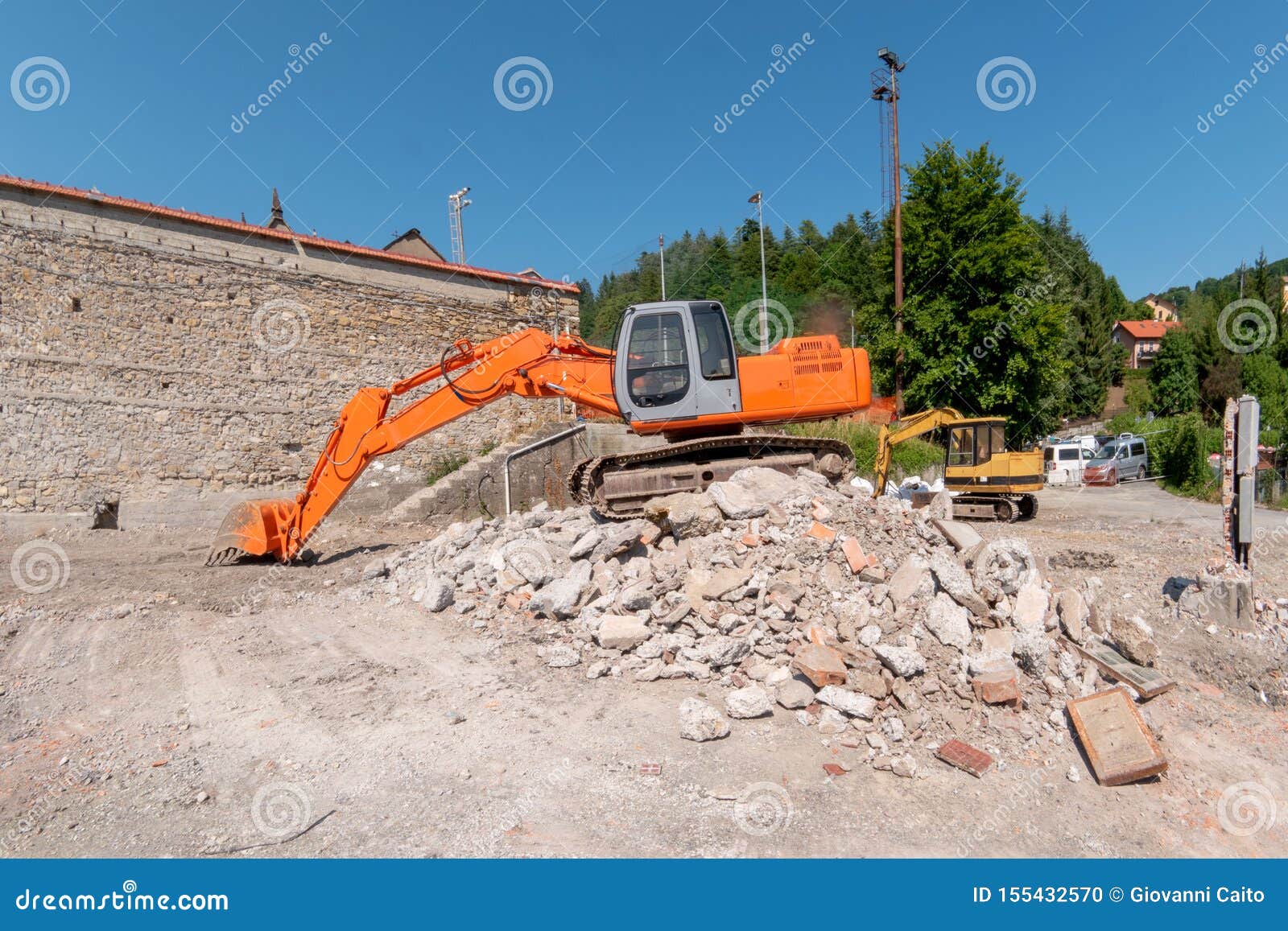 Excavator to demolish stock photo. Image of working - 155432570