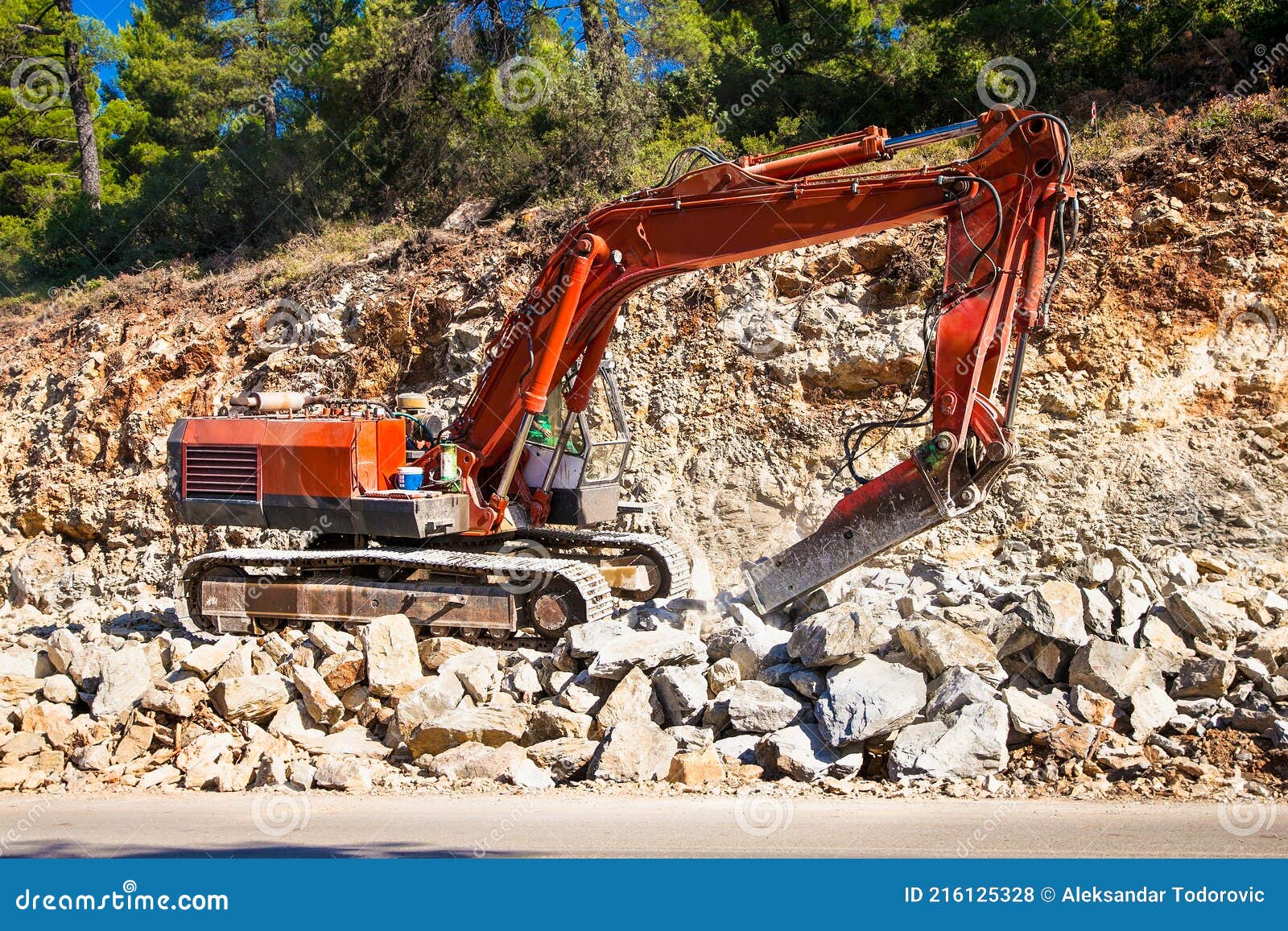 Excavator In A Stone Extraction Mine To Transform Into A Gravel Royalty ...