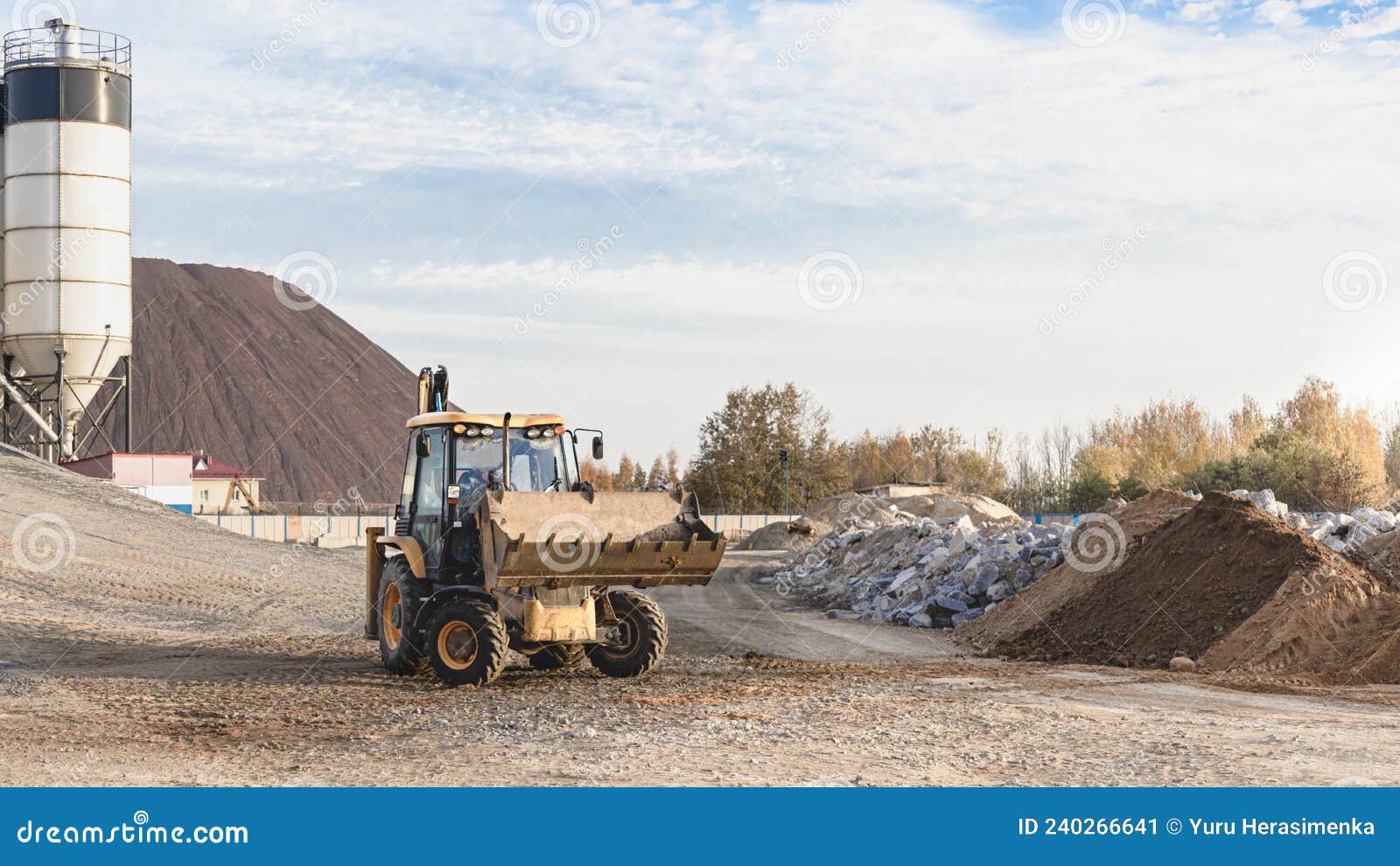 The Excavator Loader Works with a Bucket for Transporting Sand at a ...