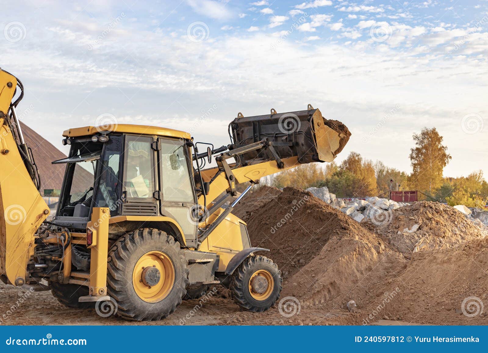 The Excavator Loader Works with a Bucket for Transporting Sand at a ...