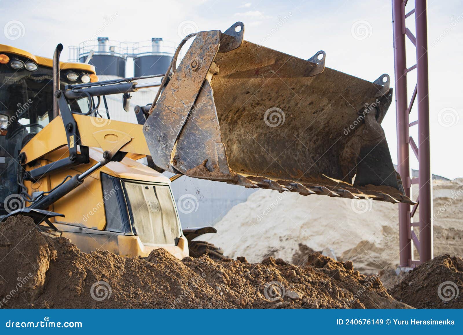 The Excavator Loader Works with a Bucket for Transporting Sand at a ...