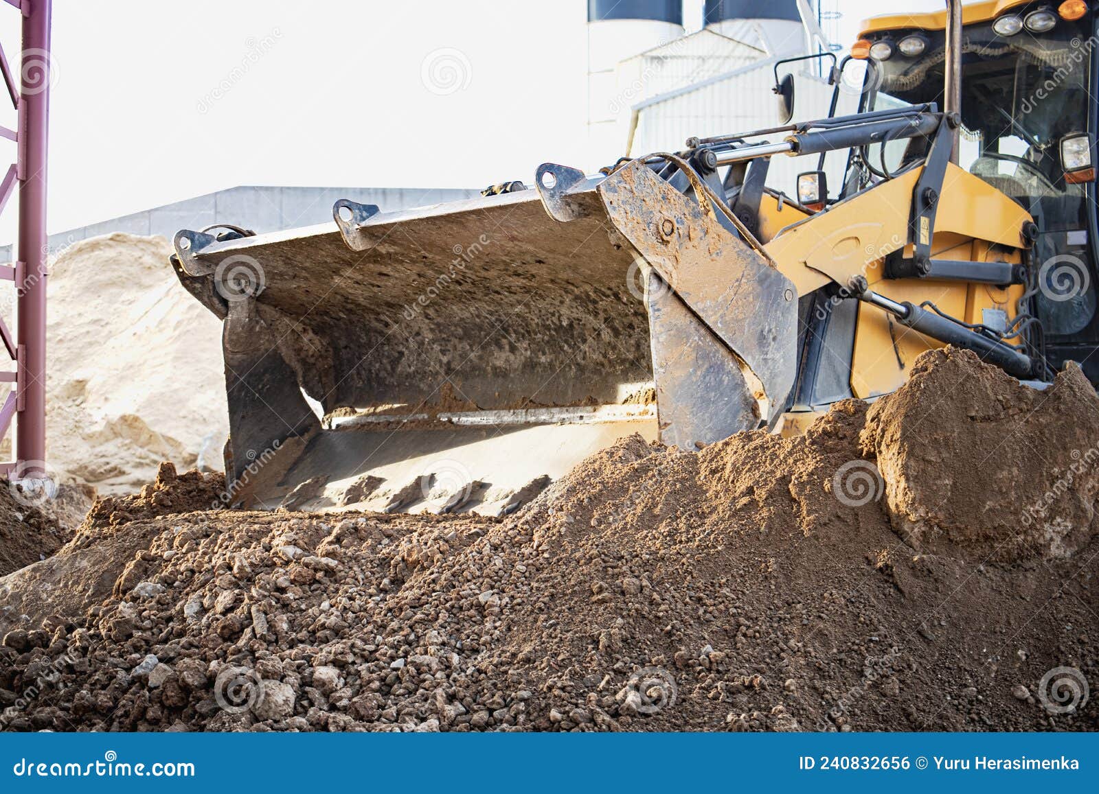 The Excavator Loader Works with a Bucket for Transporting Sand at a ...