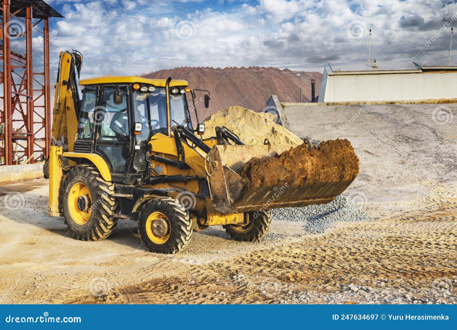 The Excavator Loader Works with a Bucket for Transporting Sand at a ...