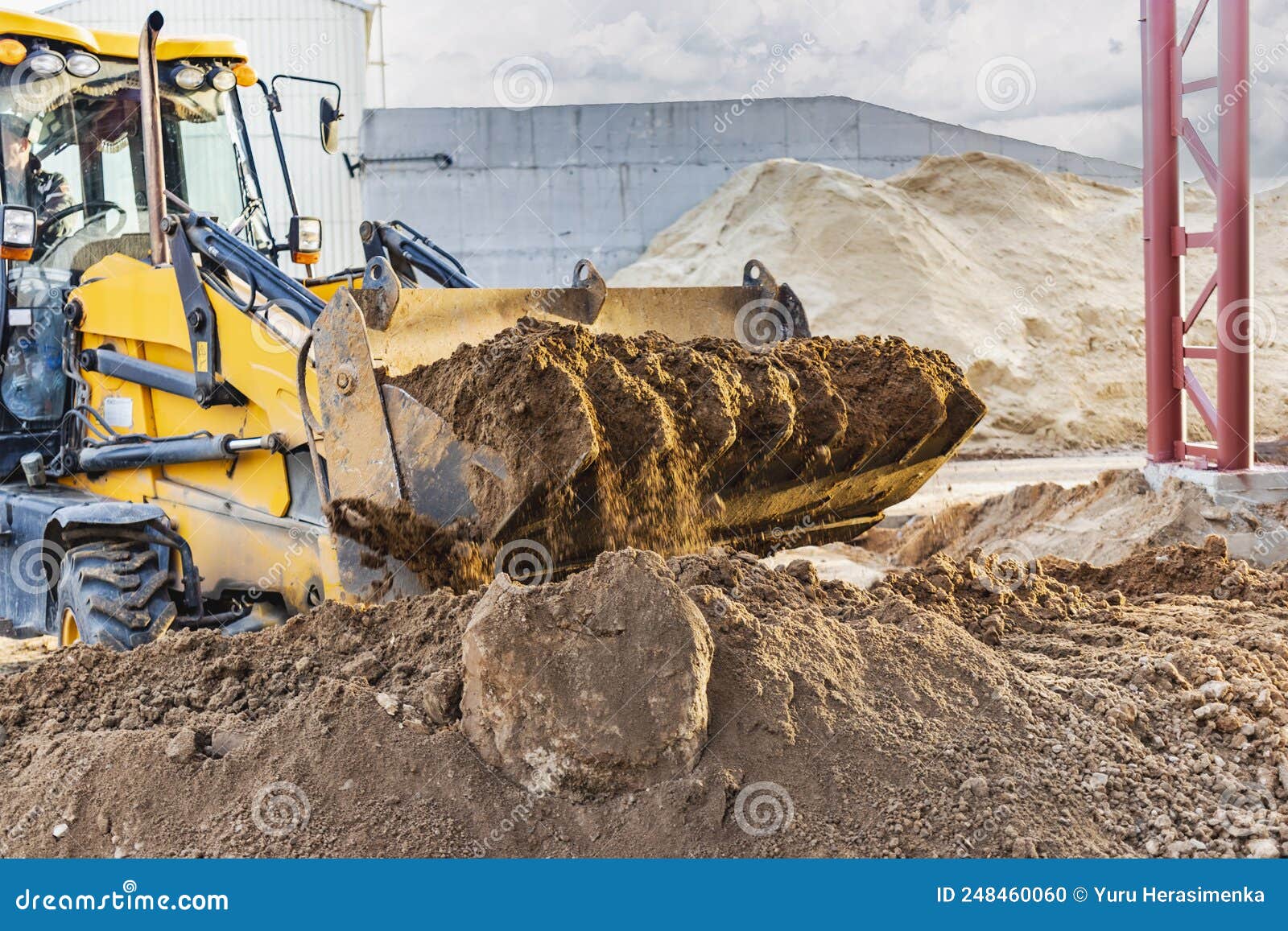 The Excavator Loader Works with a Bucket for Transporting Sand at a ...