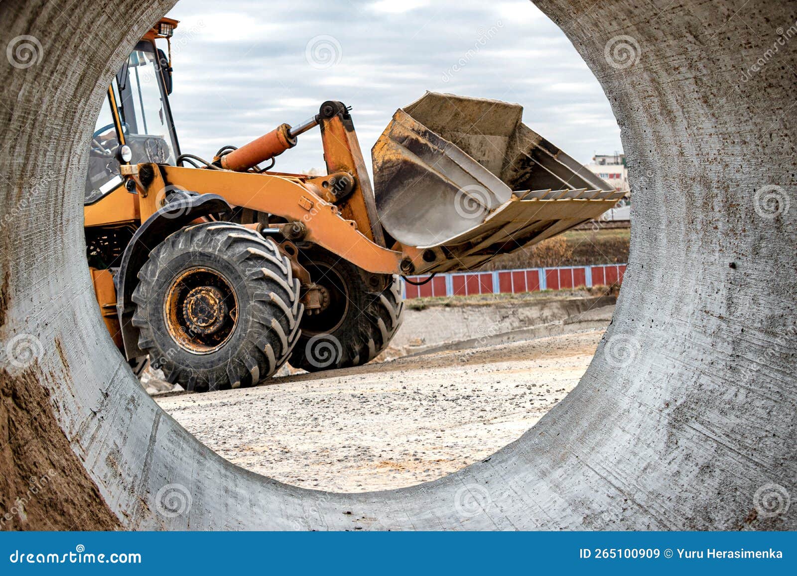 The Excavator Loader Works with a Bucket for Transporting Sand at a ...