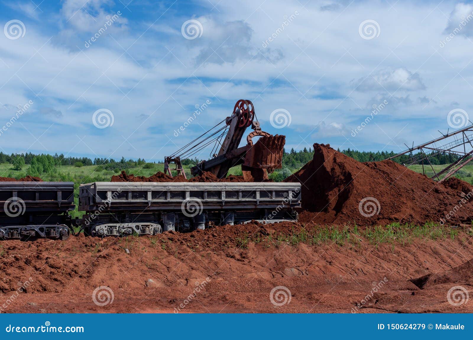 Excavator Loading Clay To the Train Stock Image - Image of train, clay ...