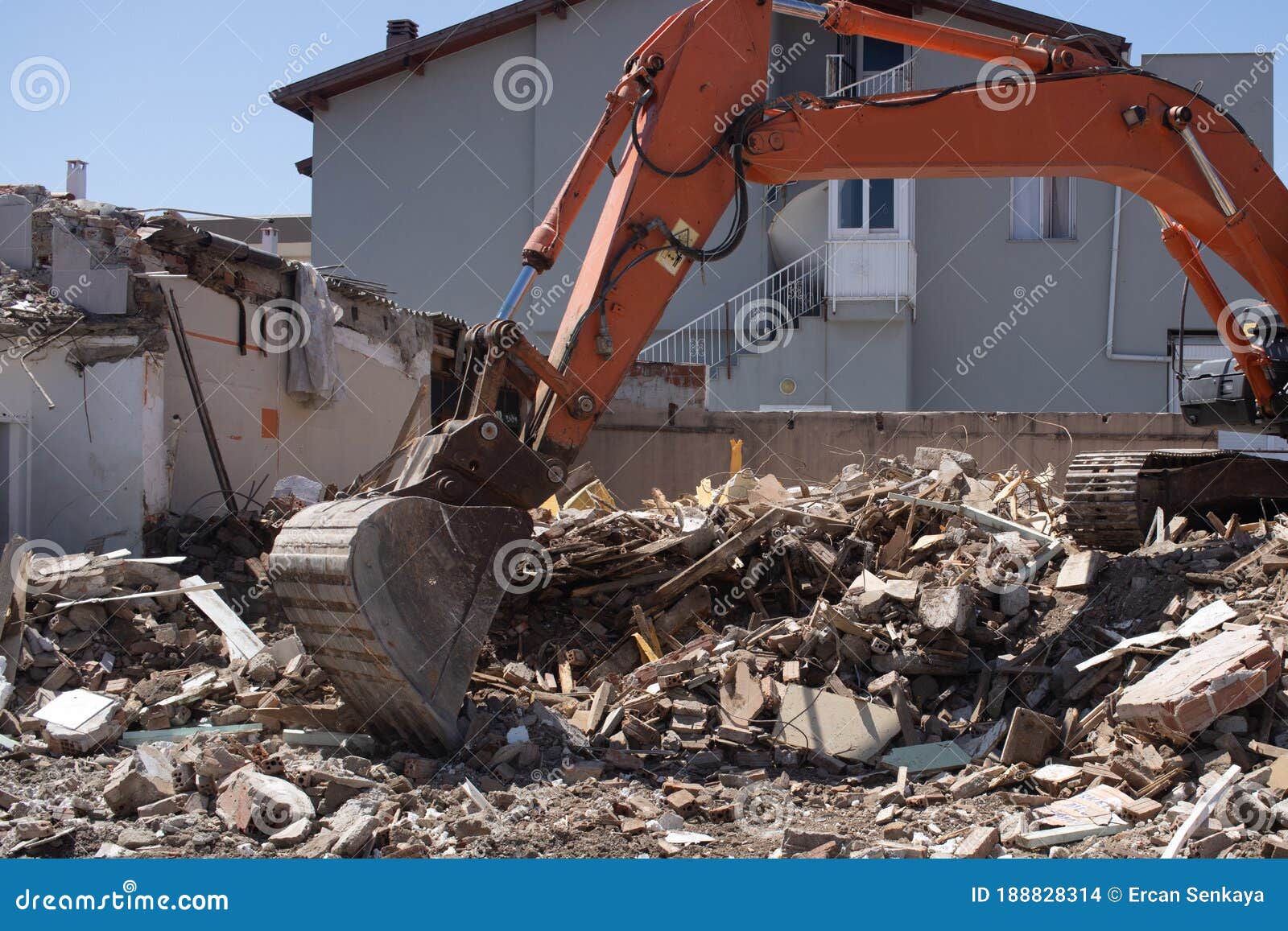 Excavator Loading Debris of a Destroyed Building Stock Photo - Image of ...