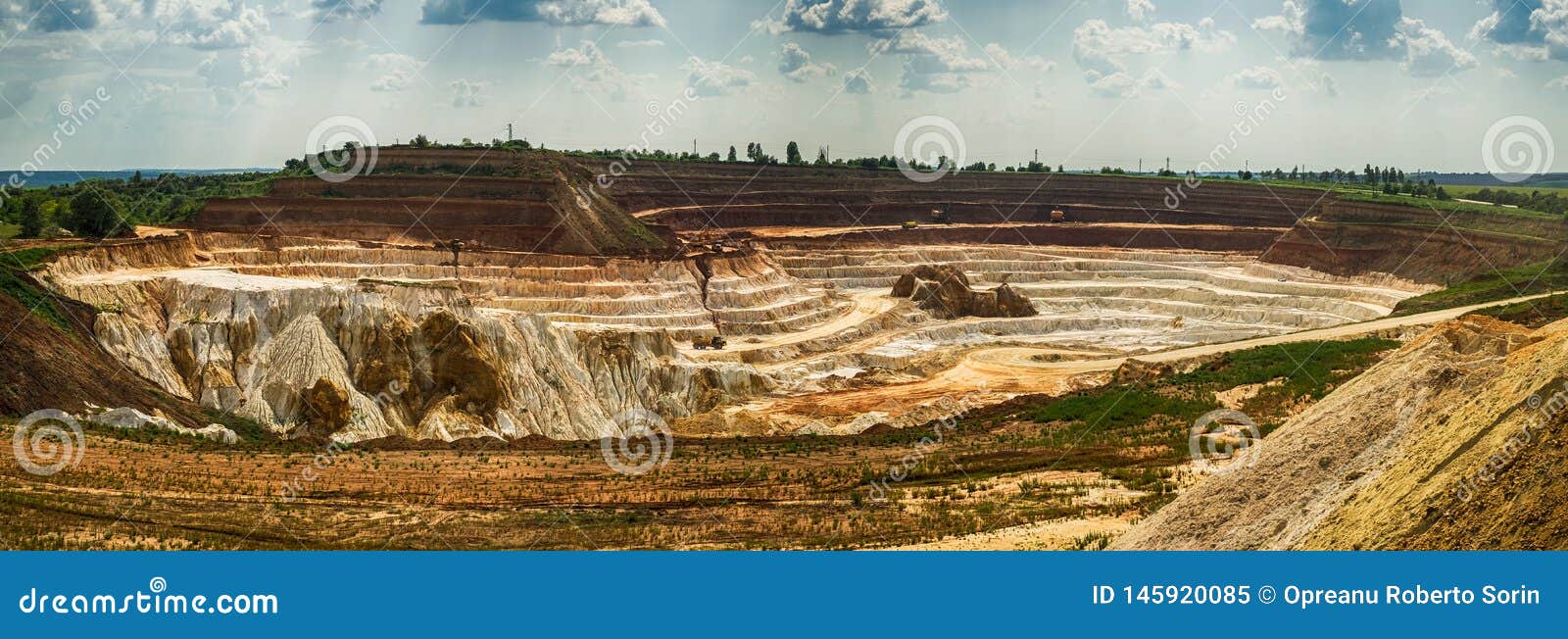 Excavator Loading Dump Truck with Raw Kaolin in Kaolin Open Pit Stock ...