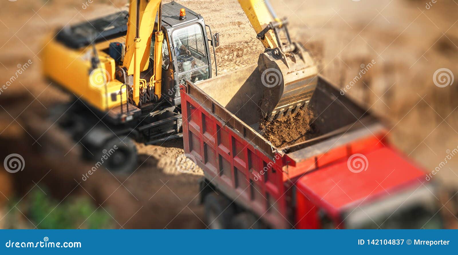 Excavator Is Loading Excavation To The Truck. Excavators Hydraulic Are ...