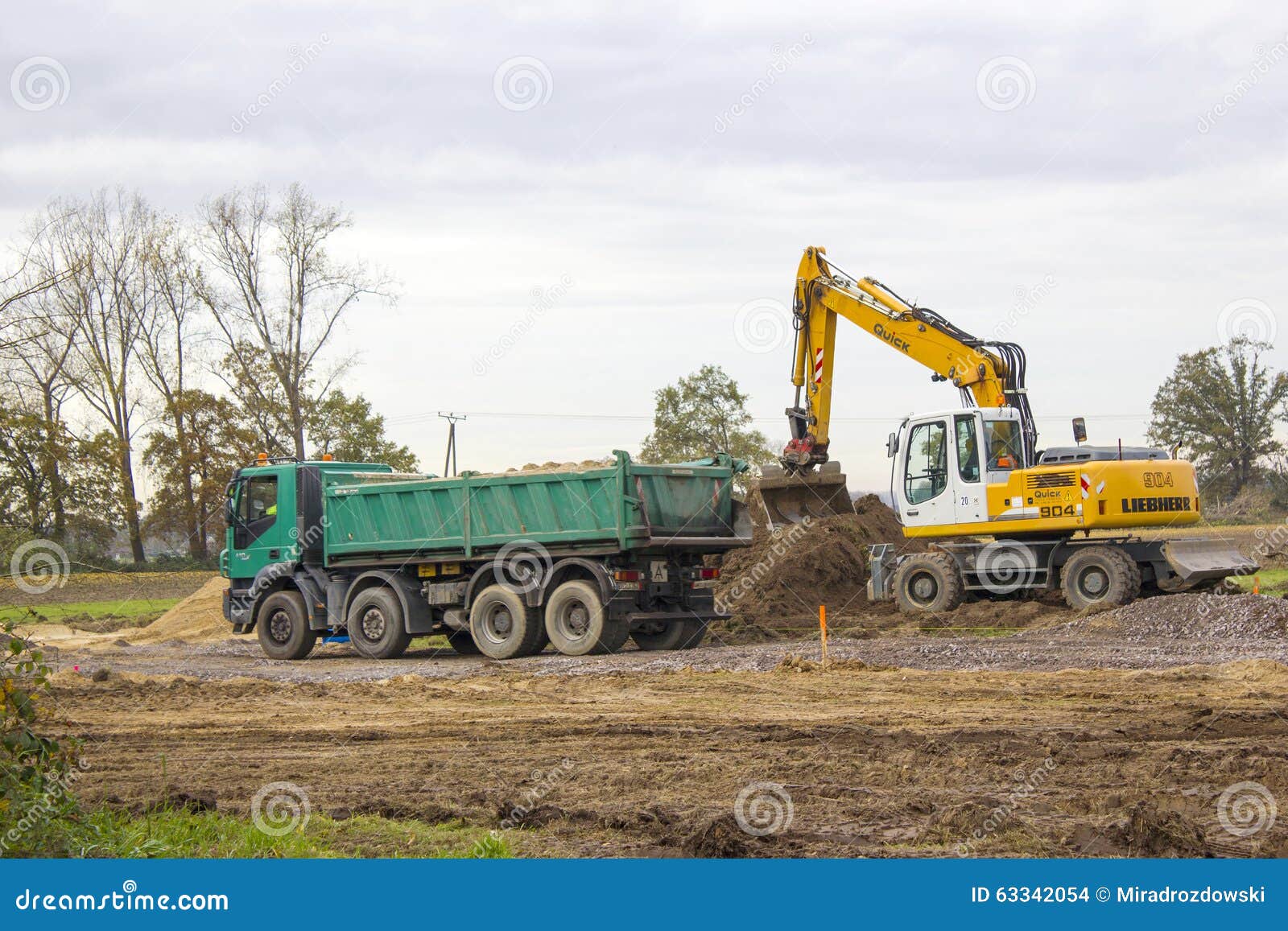 Excavator Loading Dumper Truck Tipper in Sand Pit Editorial Stock Image ...