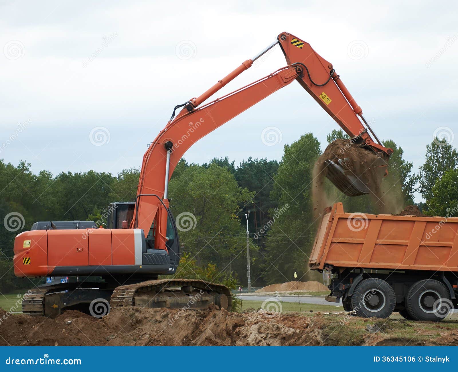 Excavator Loading Dumper Truck Stock Photo - Image of pour, field: 36345106