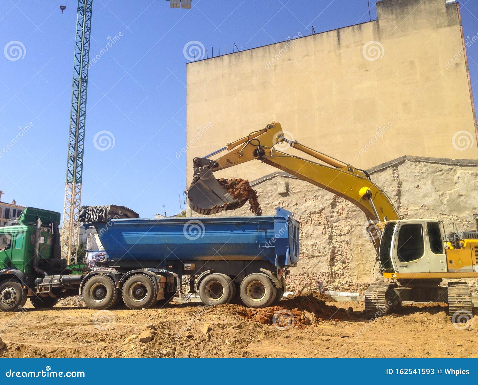 Excavator Loading Earth at Construction Site Stock Image - Image of ...