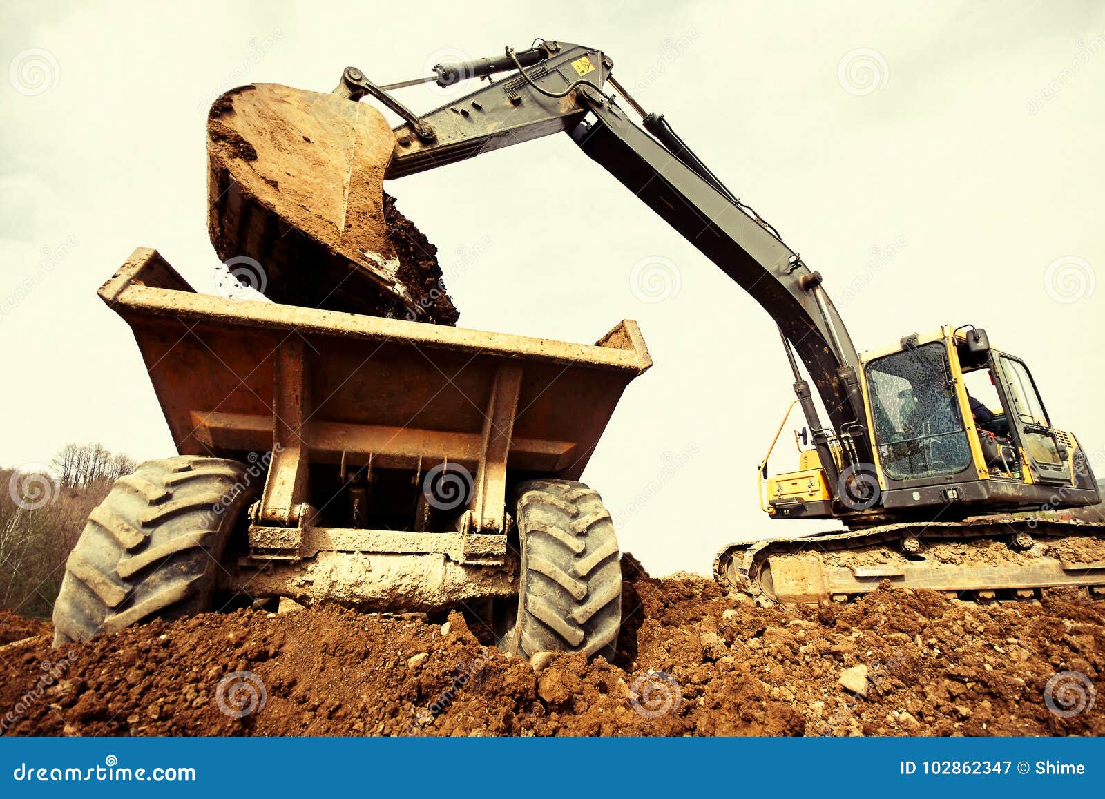 Excavator loading stock image. Image of construction - 102862347