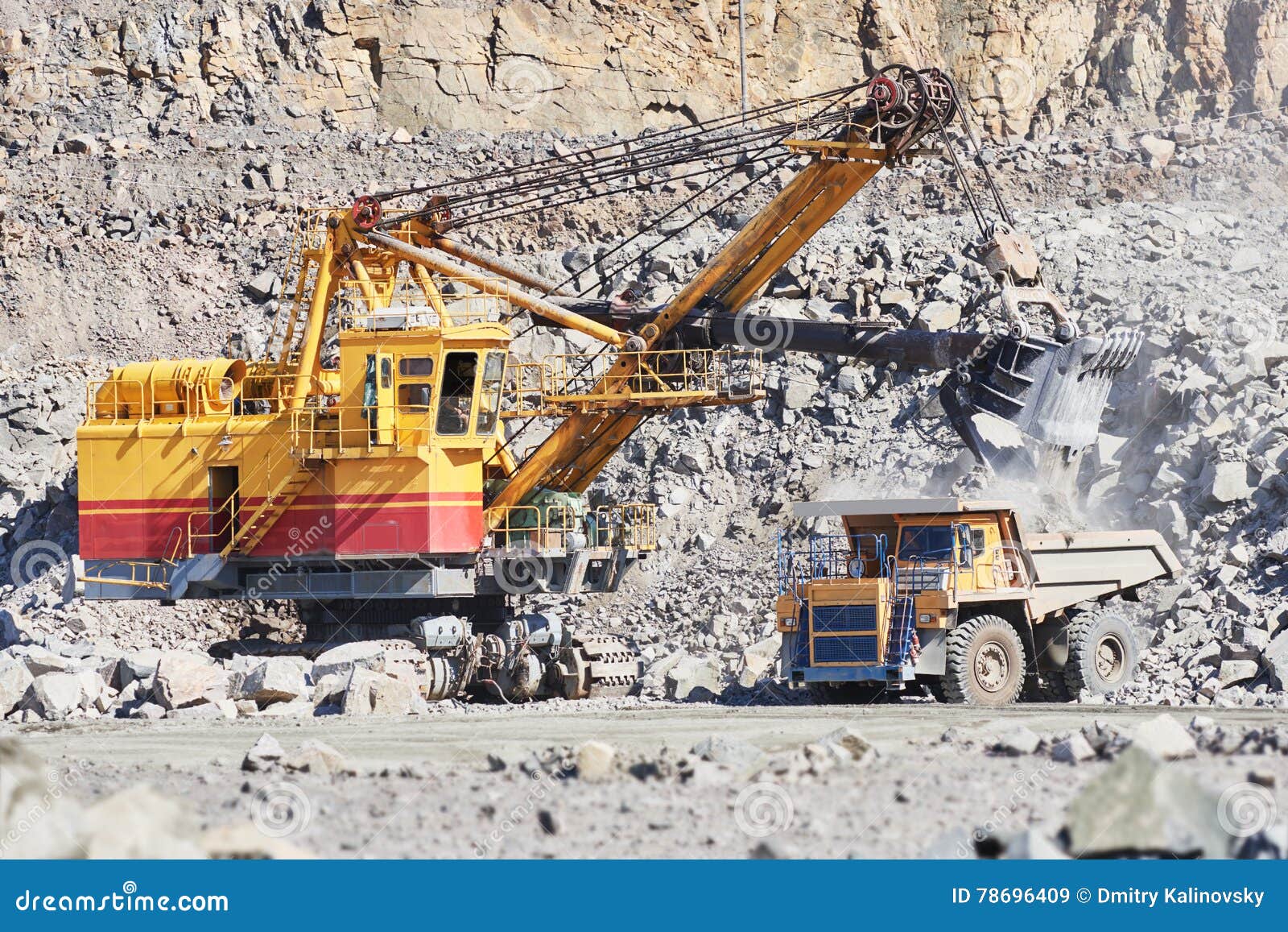 Excavator Is Loading Excavation To The Truck. Excavators Are Heavy ...