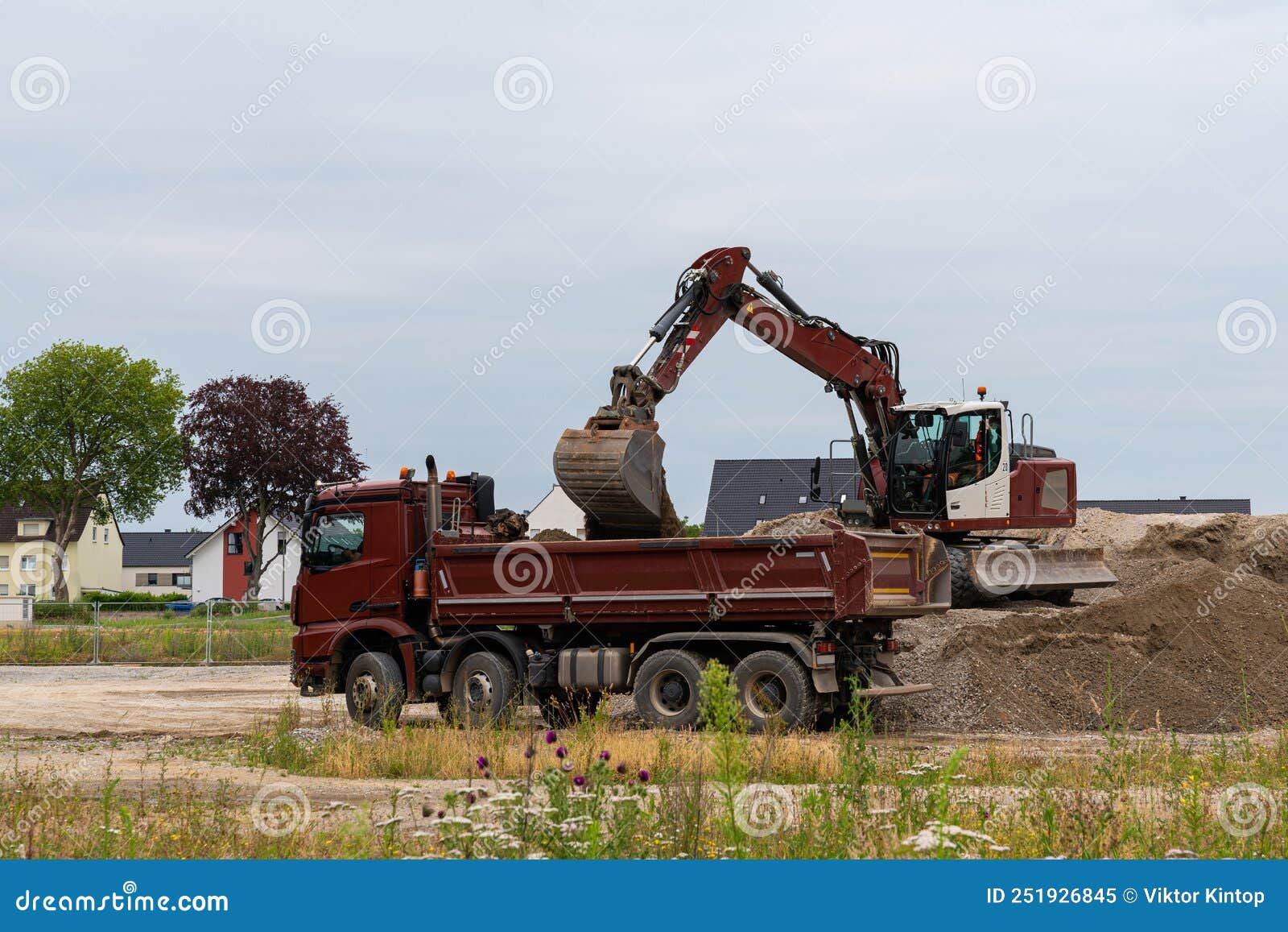 Excavator Loading Gravel into a Truck Stock Image - Image of loader ...