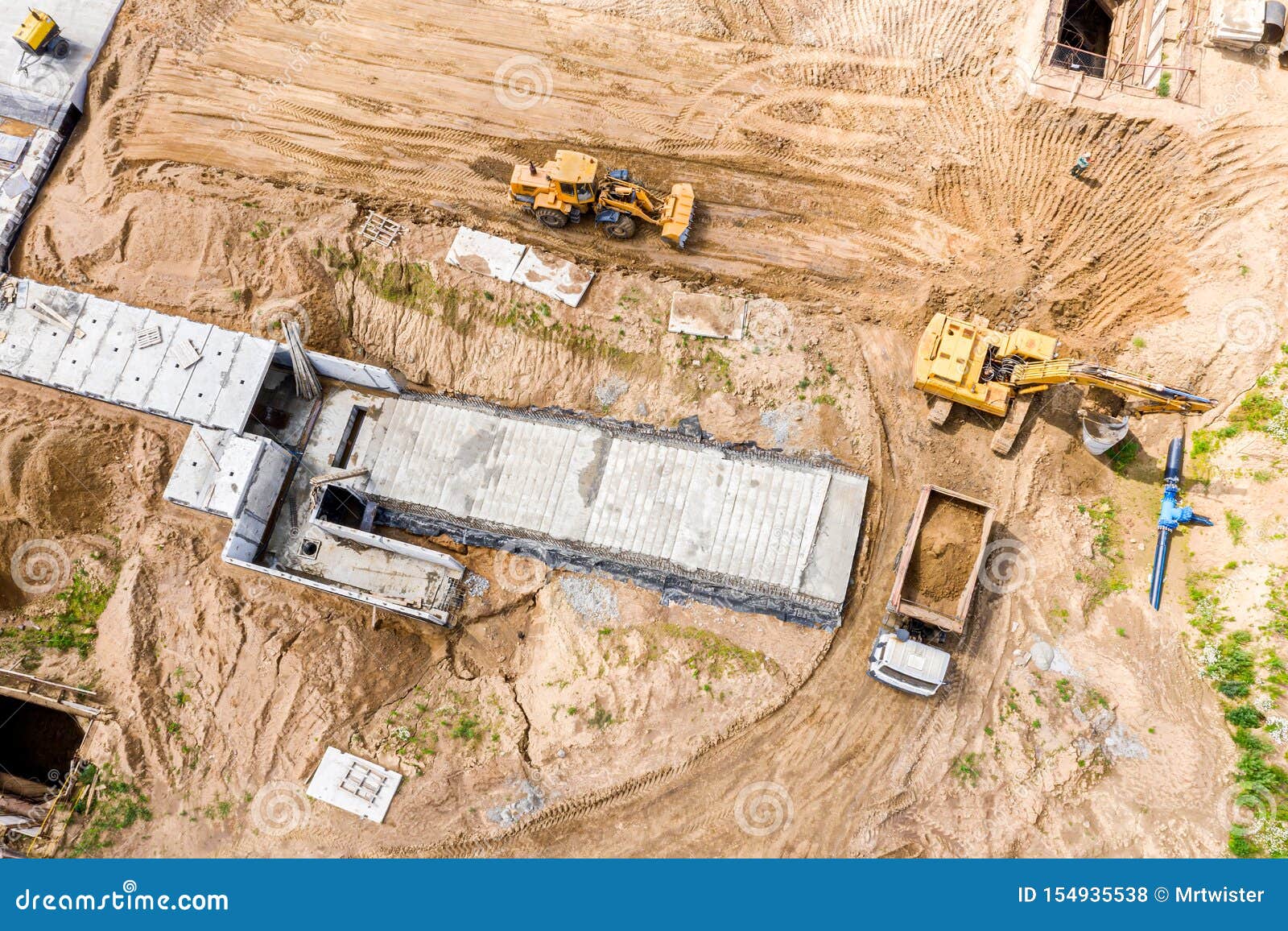 Excavator Loading Ground into a Dump Truck on Road Construction Site ...