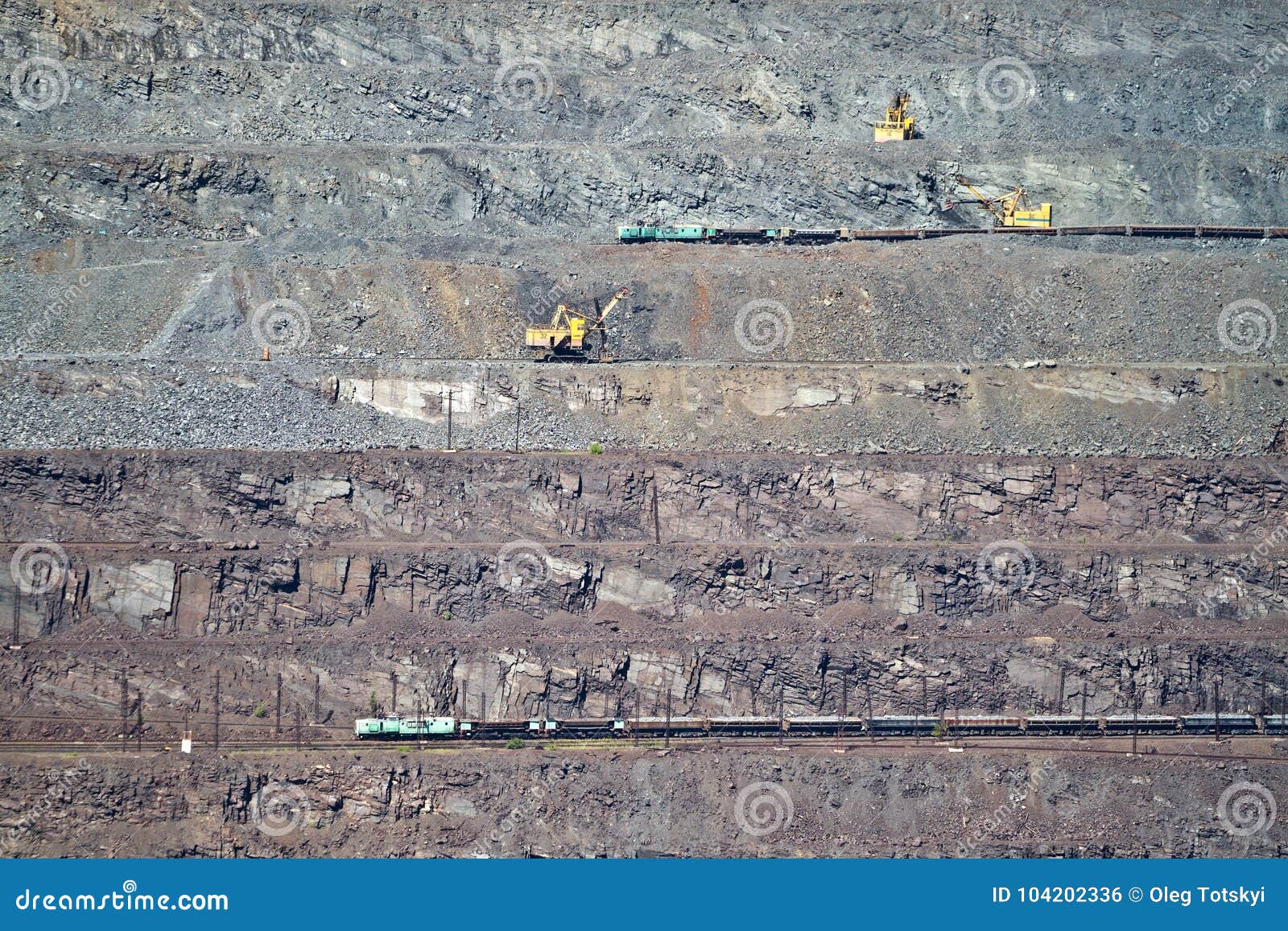 Excavator Loading Iron Ore into Goods Wagon on the Iron Ore Opencast ...