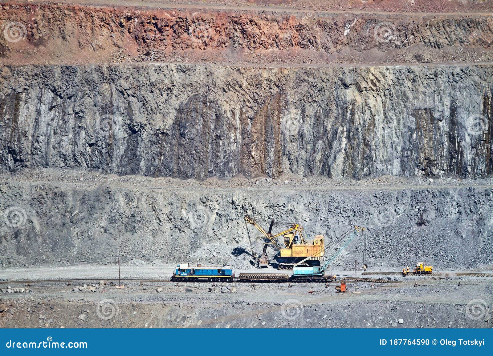 Excavator Loading Iron Ore into Goods Wagon on the Iron Ore Opencast ...